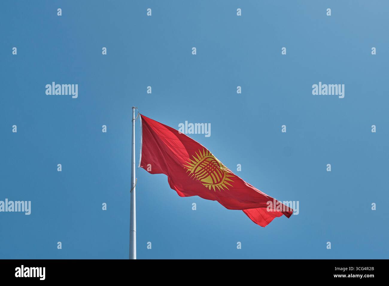 Kyrgyzstan, Bishkek - July 12, 2025: National flag of Kyrgyzstan with ...
