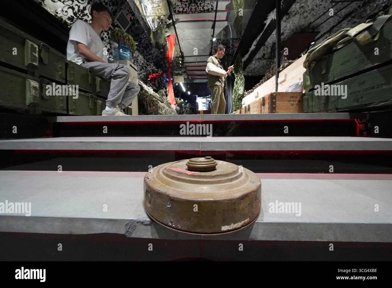 An anti-tank training mine lies on the steps at a museum of Russian ...