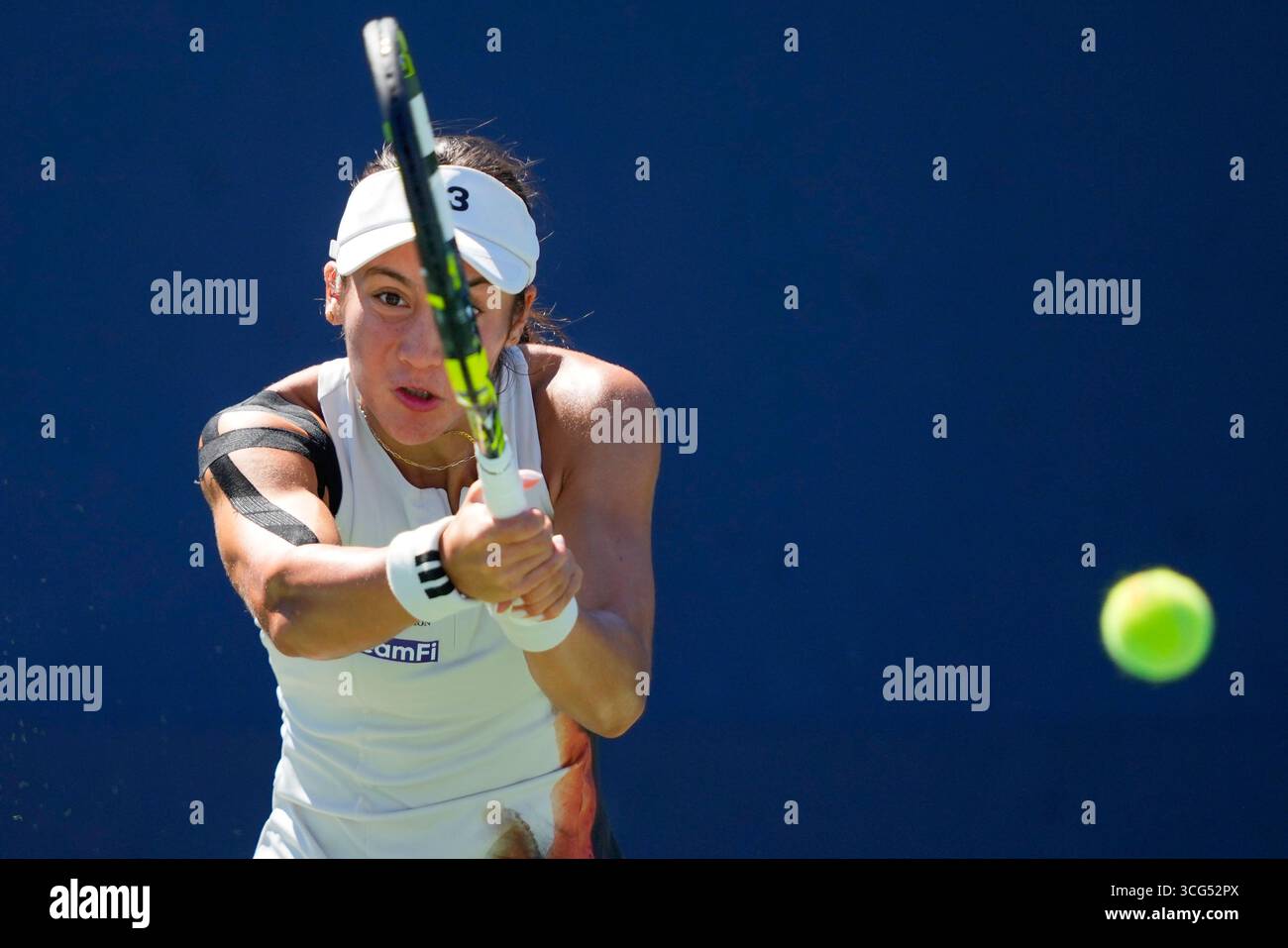 Valerie Glozman, of the United States, returns a shot to Suzan Lamens ...