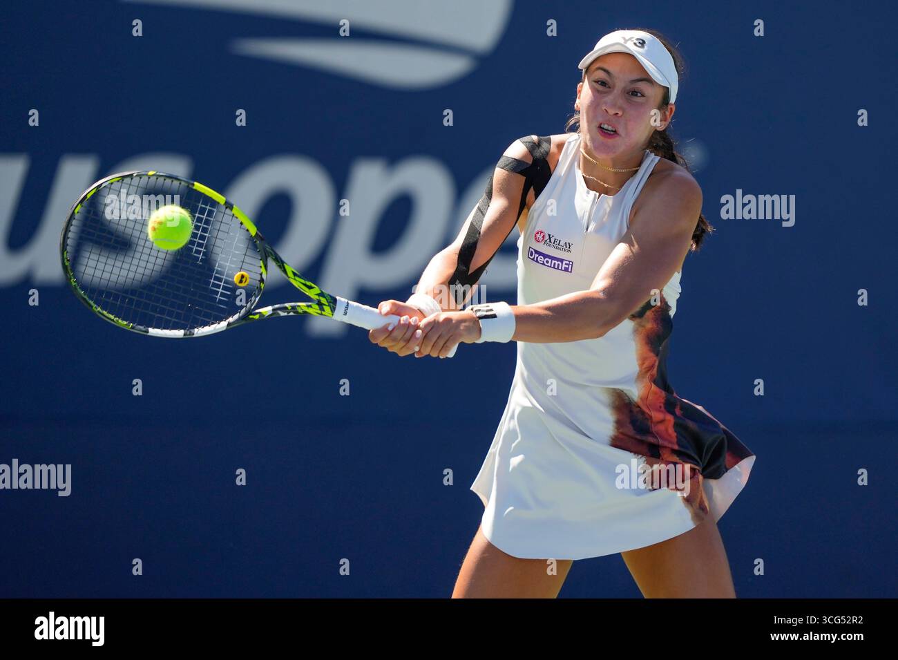 Valerie Glozman, of the United States, returns a shot to Suzan Lamens ...