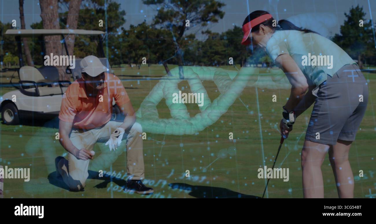 Golf partners wearing visors practicing putting on green, with putter ...