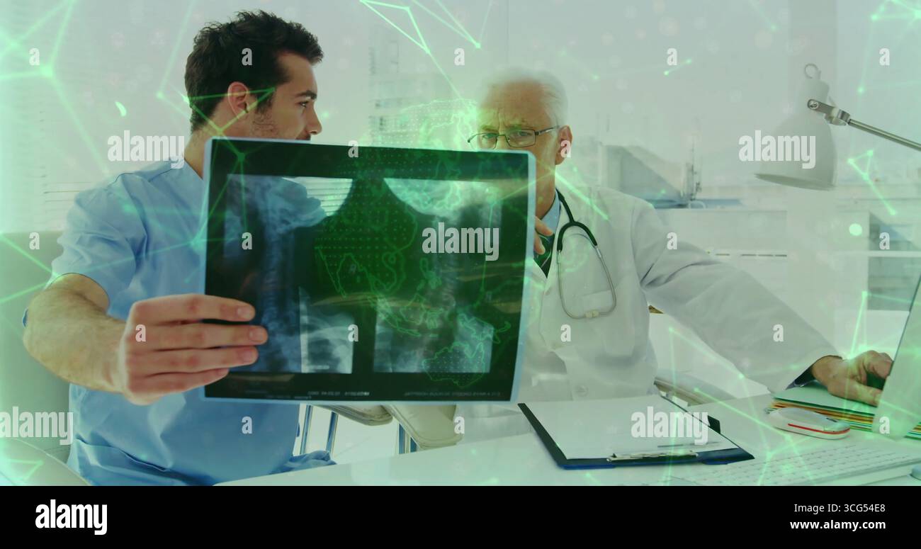 Holding chest X-ray film, doctor in scrubs examining scan in clinic ...