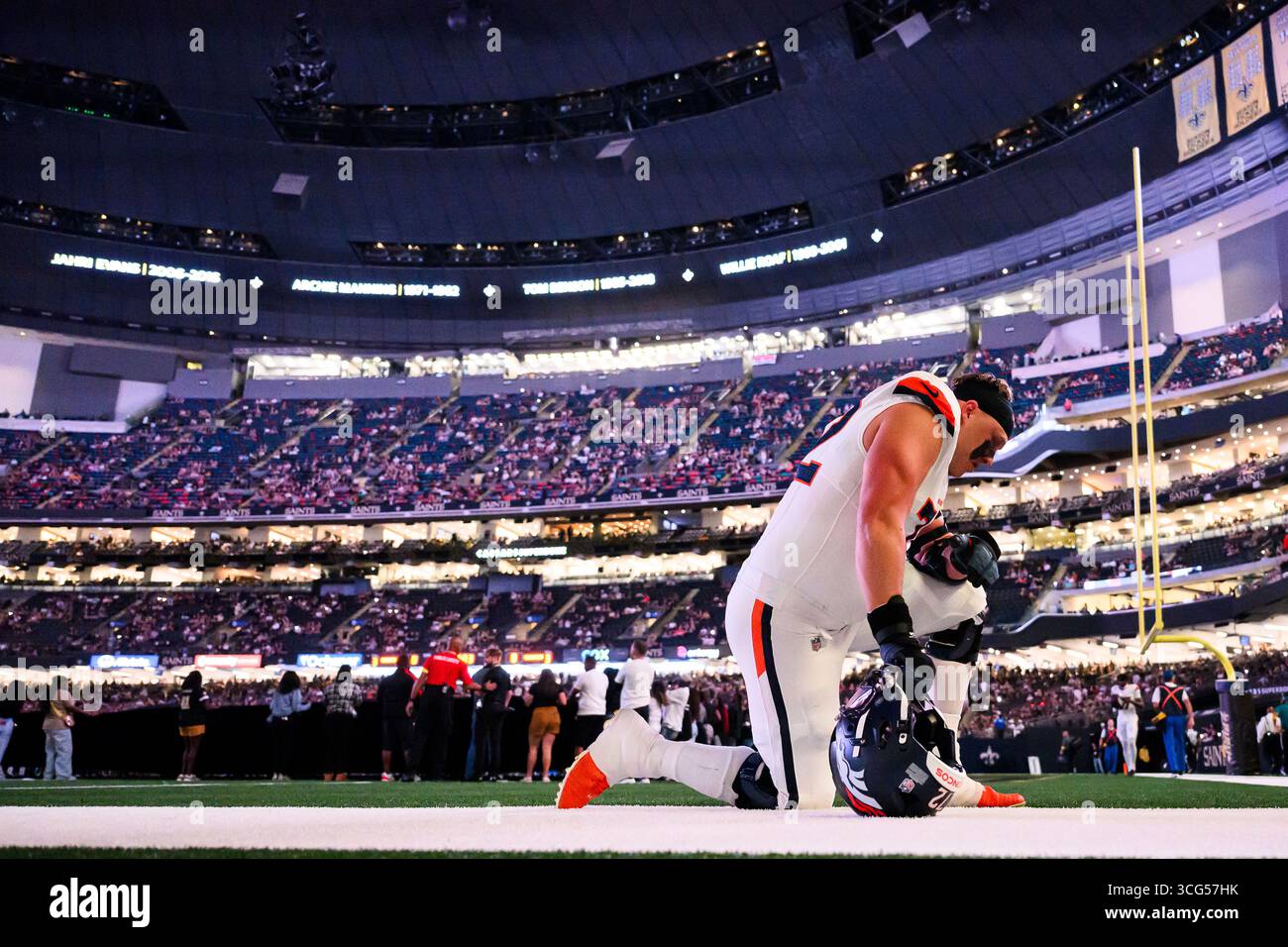 Garrett Bolles #72 of the Denver Broncos praying before an NFL ...