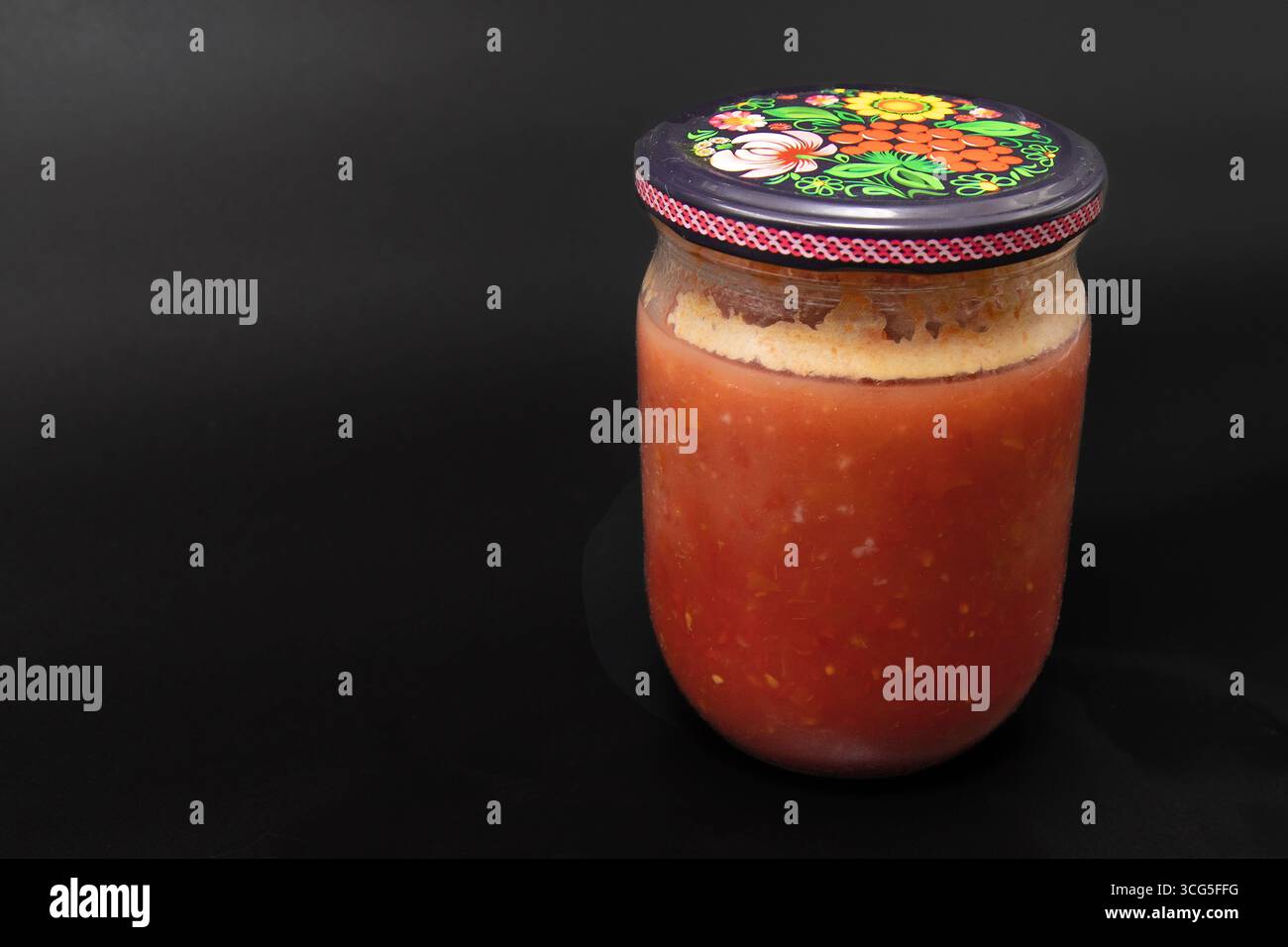 Close up of glass jar with spoiled tomato sauce covered with mold on ...
