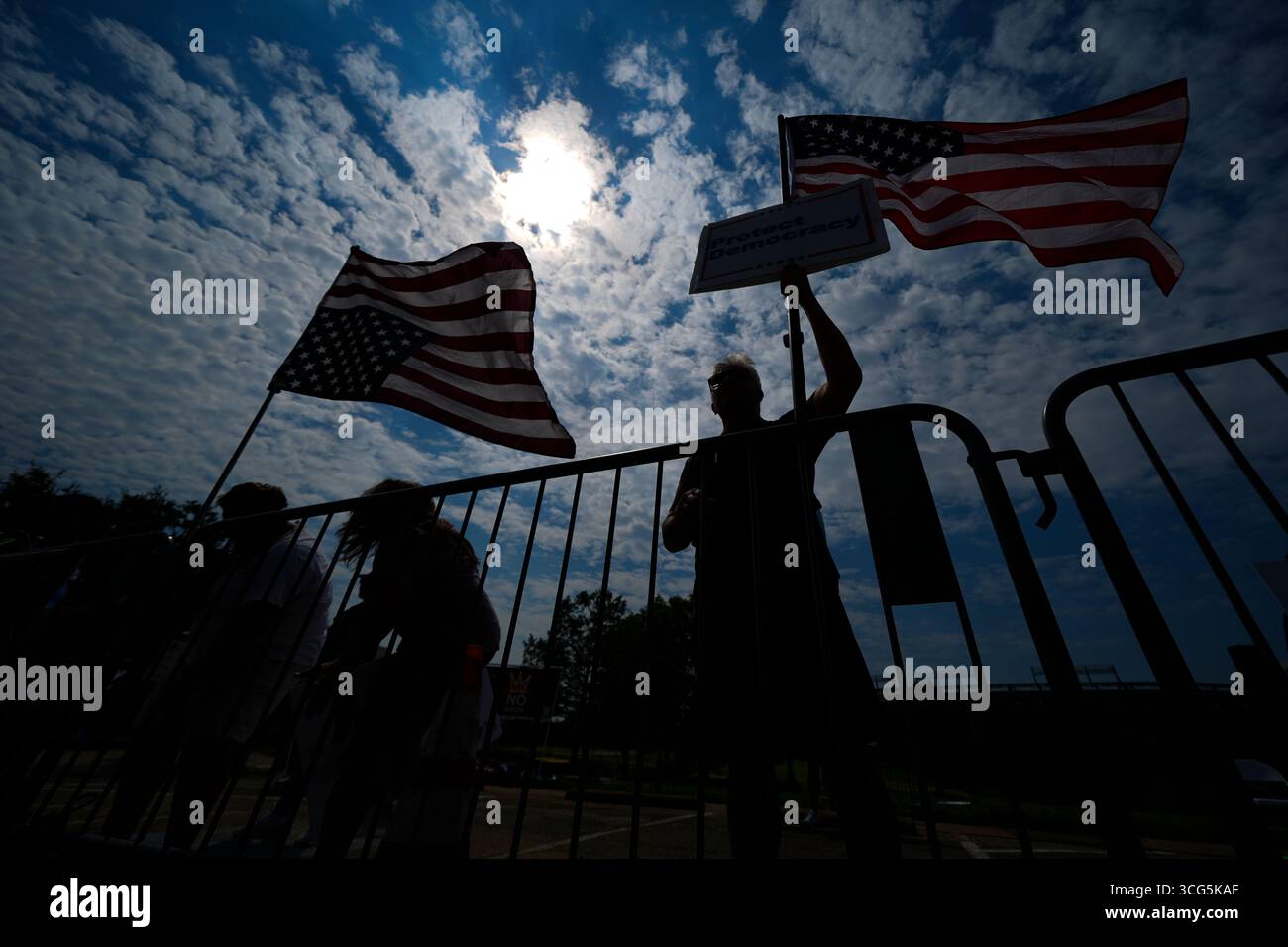 Protesters hold U.S. flags outside an ICE, Immigration and Customs ...