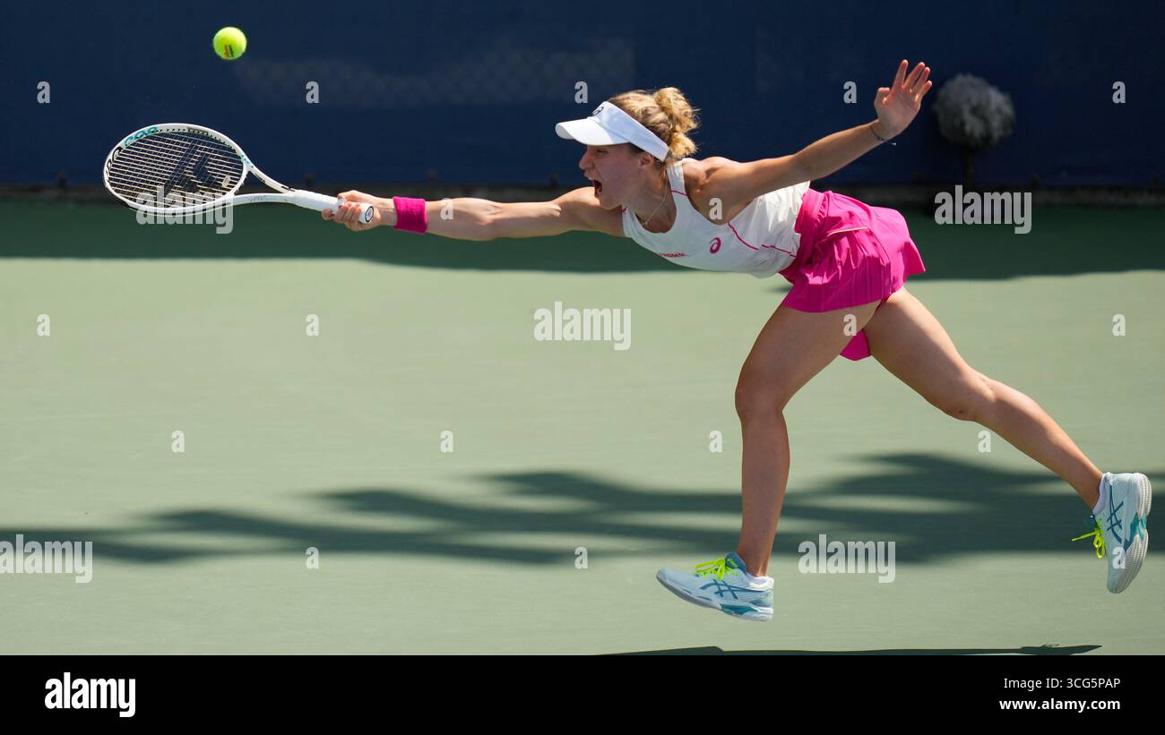 Viktorija Golubic, of Switzerland, returns a shot to Lois Boisson, of ...