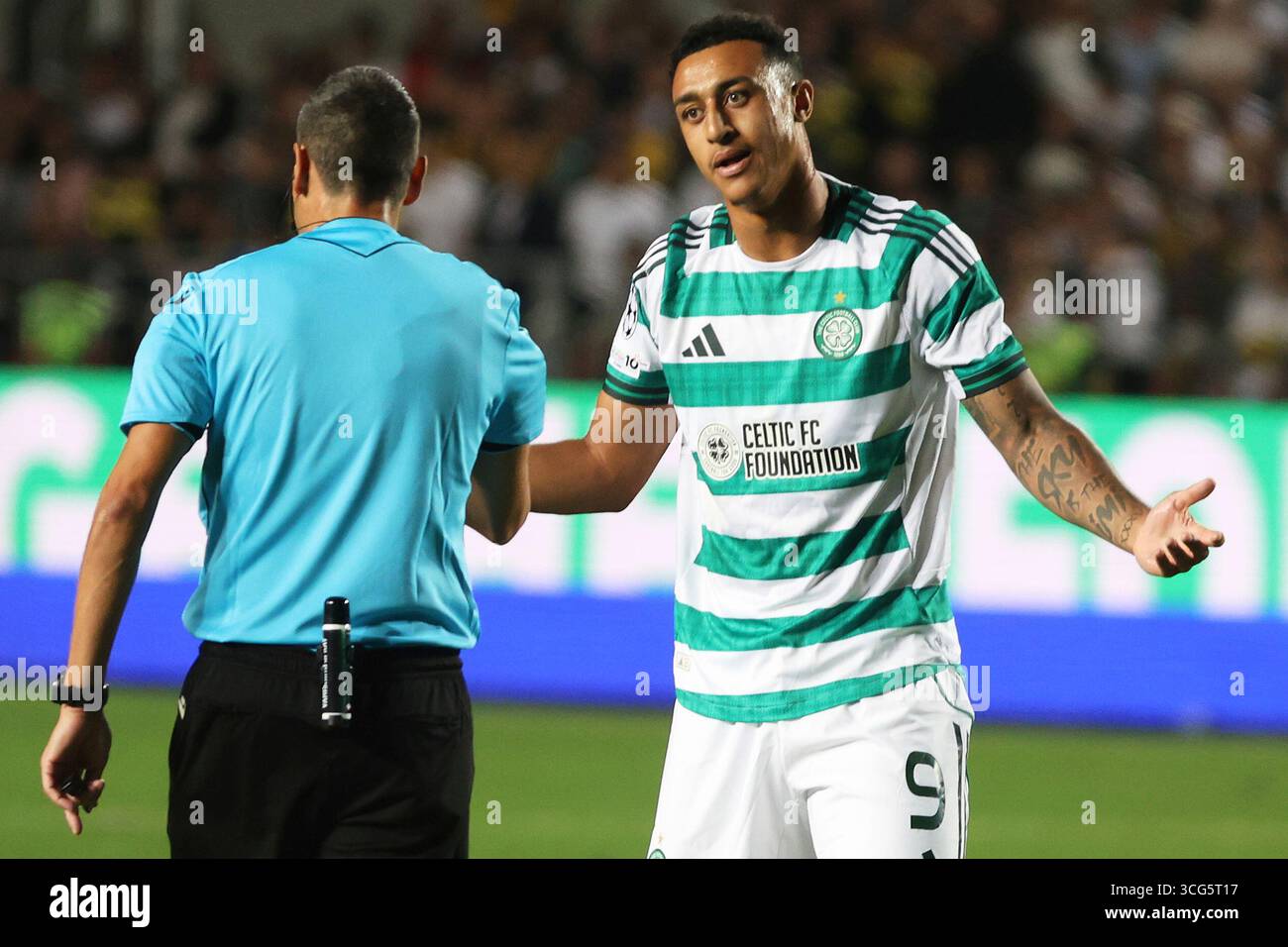 Celtic's Adam Idah, right, speaks with referee Maurizio Mariani during ...