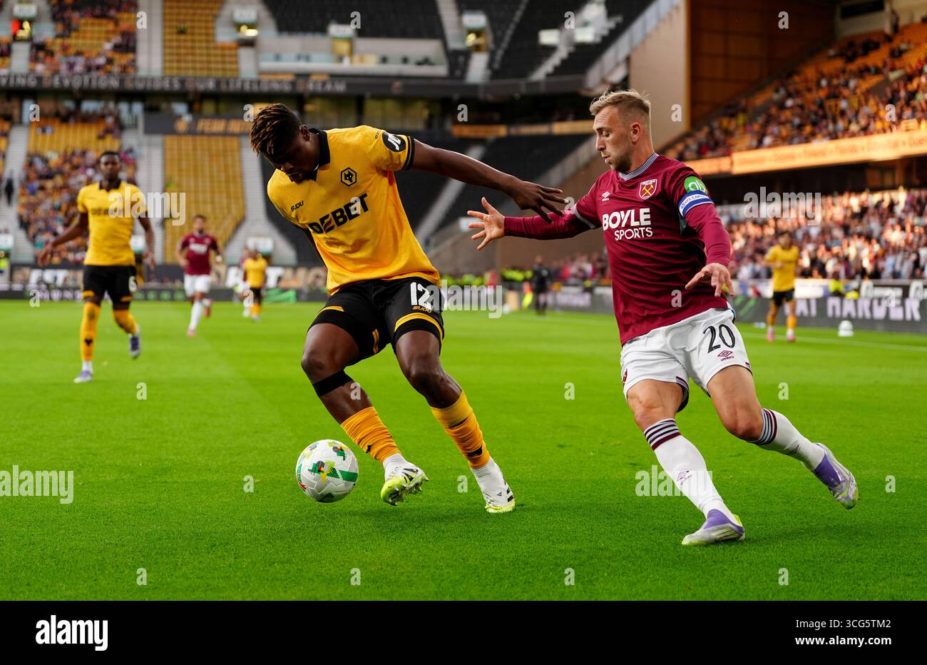 Wolverhampton Wanderers' Emmanuel Agbadou (right) and West Ham United's ...