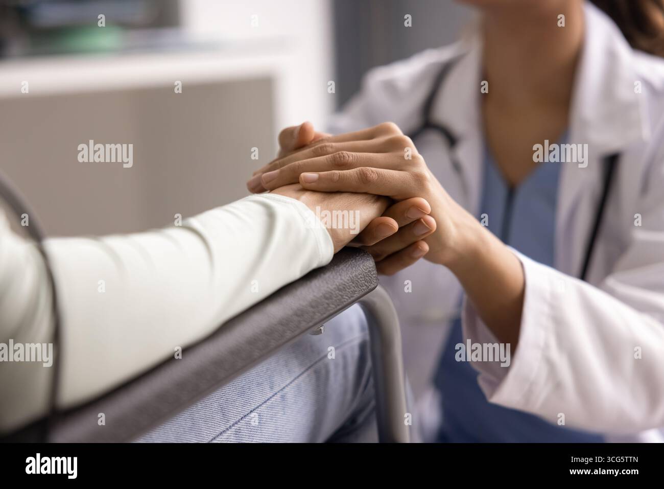 Caring empathetic doctor consoling patient with disability Stock Photo ...