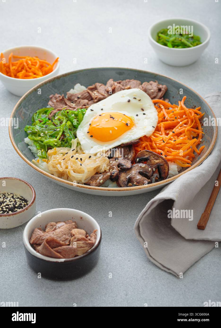 Traditional korean bibimbap with fried egg, beef and vegetables and ...