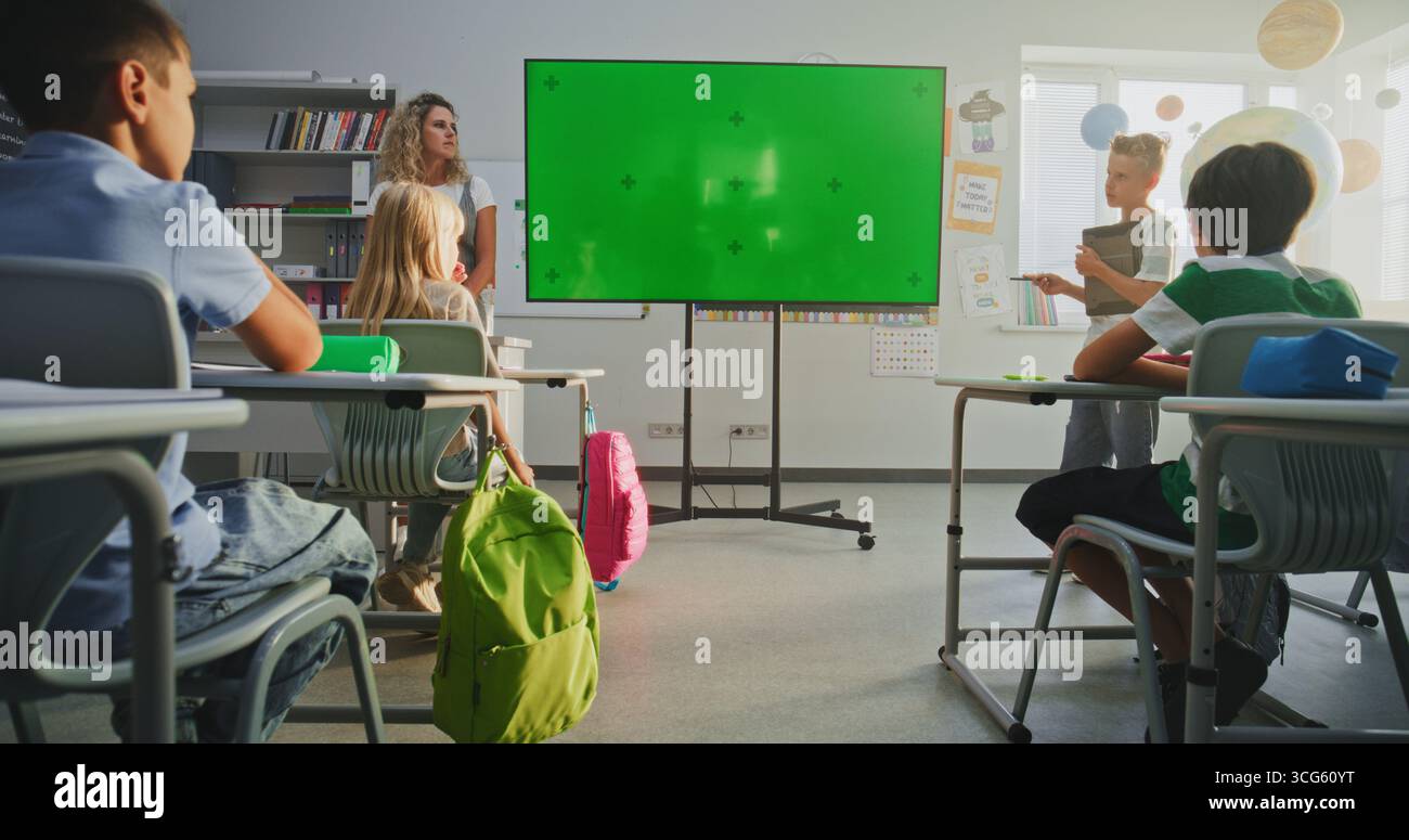 Primary School Boy with Tablet Computer Showcasing Knowledge in Front ...