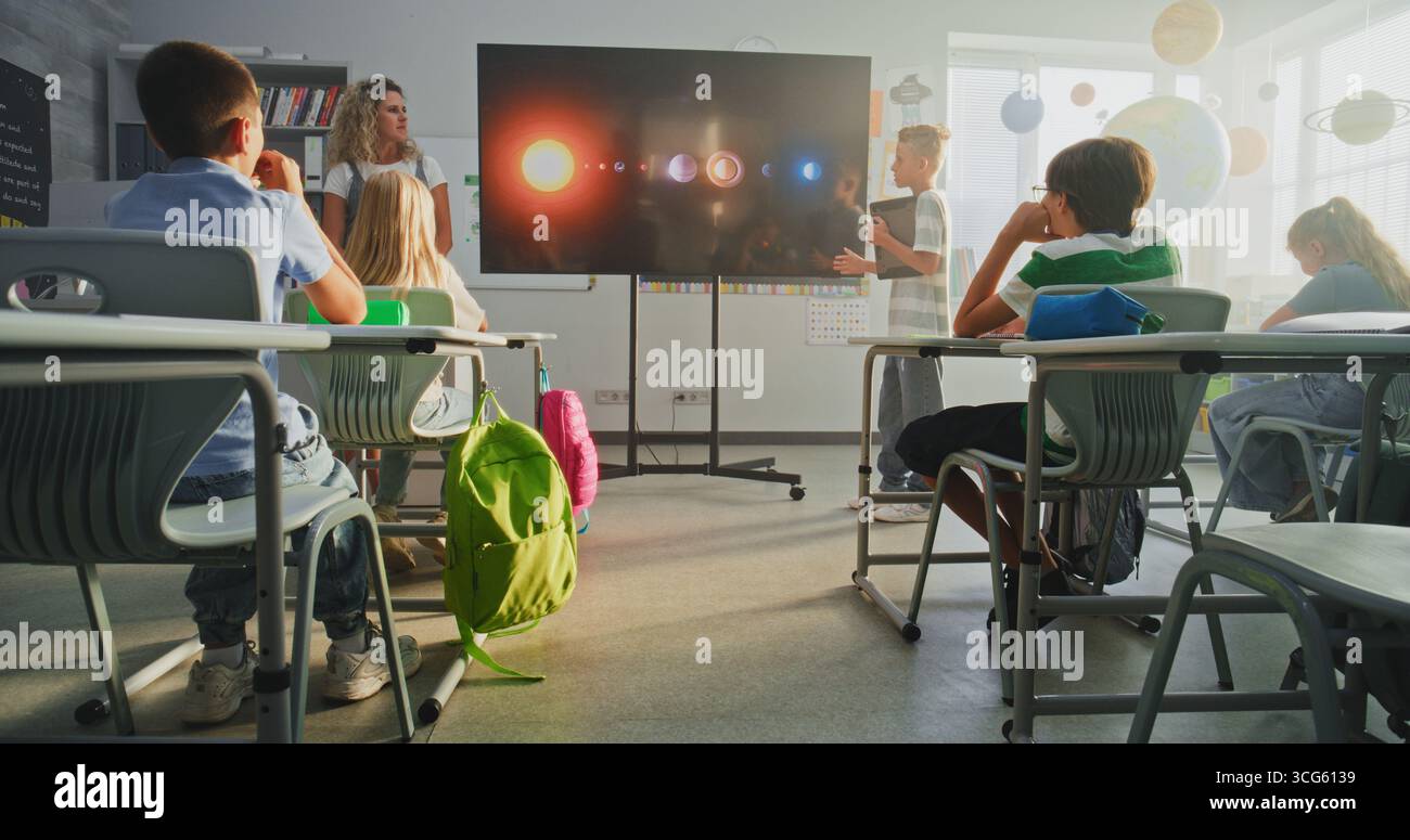 Primary School Boy with Tablet Computer Showcasing Knowledge of ...