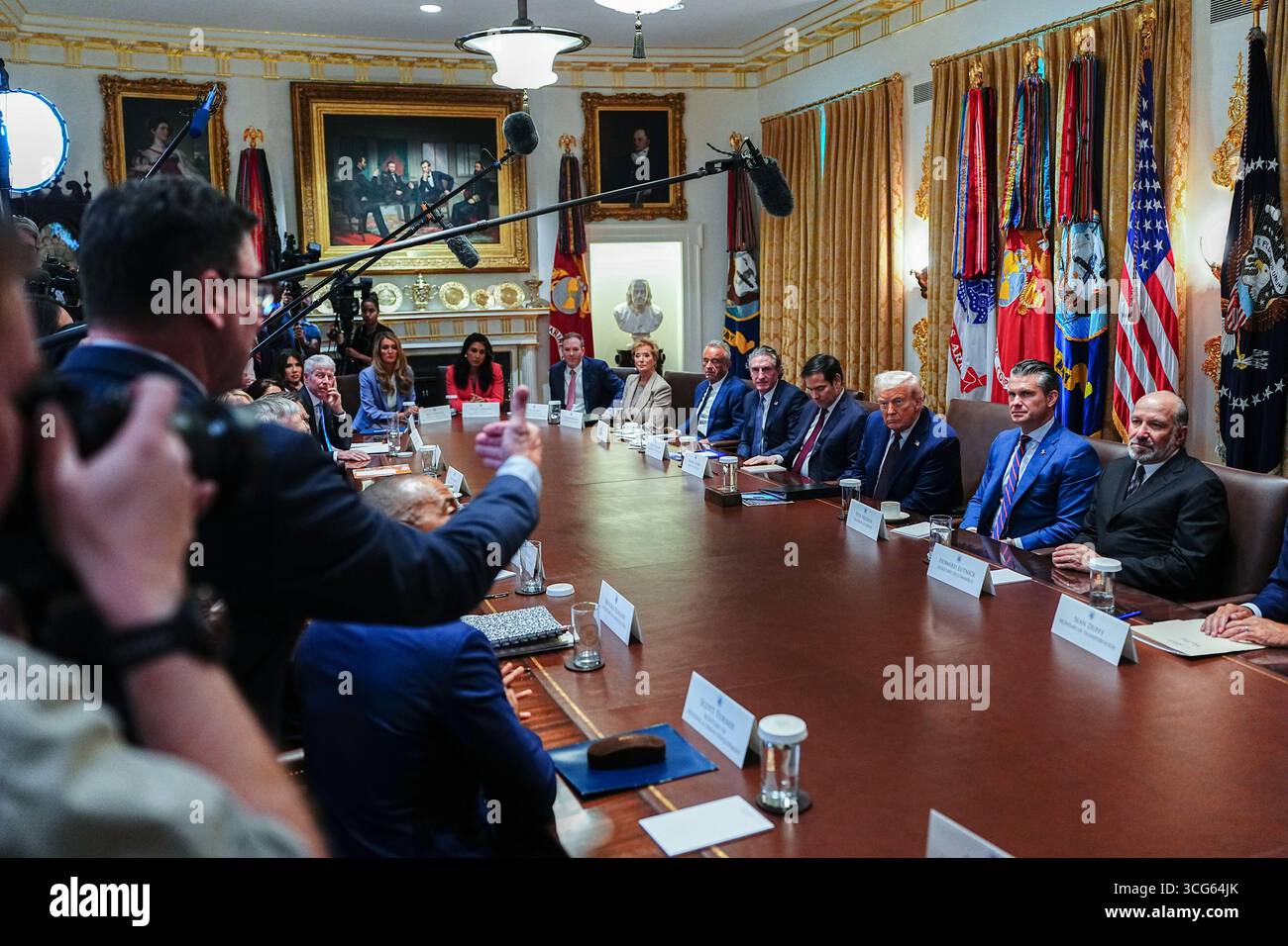 President Donald J Trump listens to reporter's questions as he chairs a ...