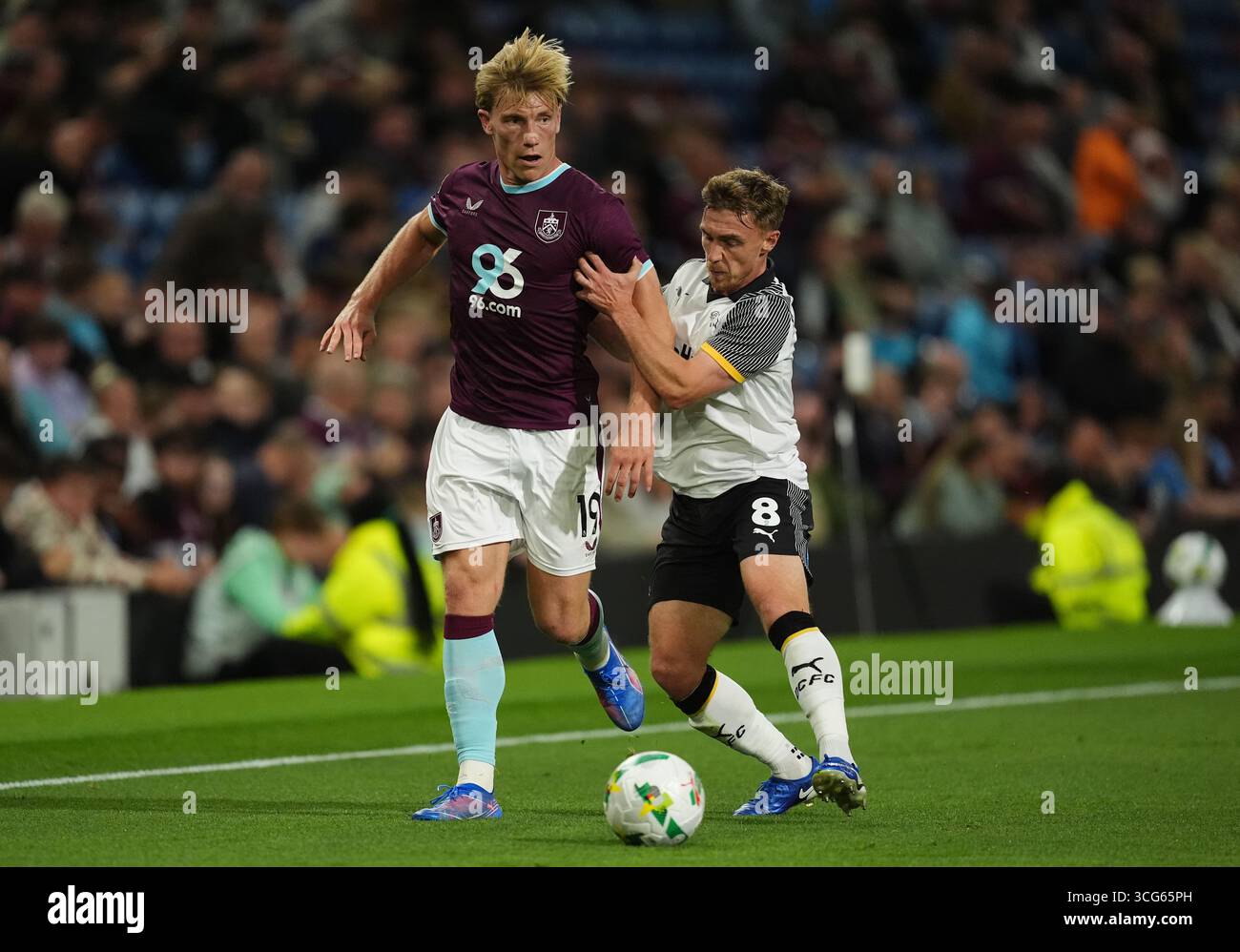 Burnley's Zian Flemming (left) and Derby County's Ben Osborn battle for ...