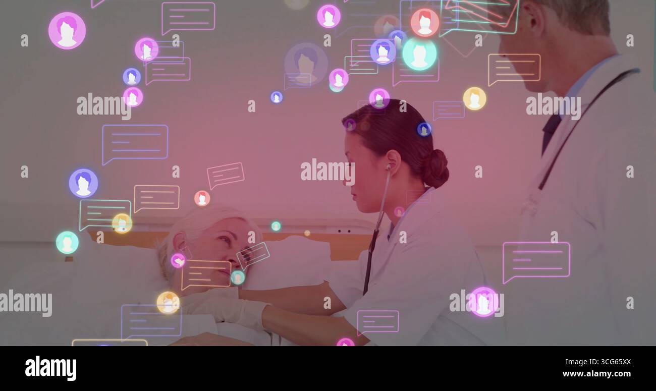 Leaning Asian doctor in coat using stethoscope on patient chest in ...
