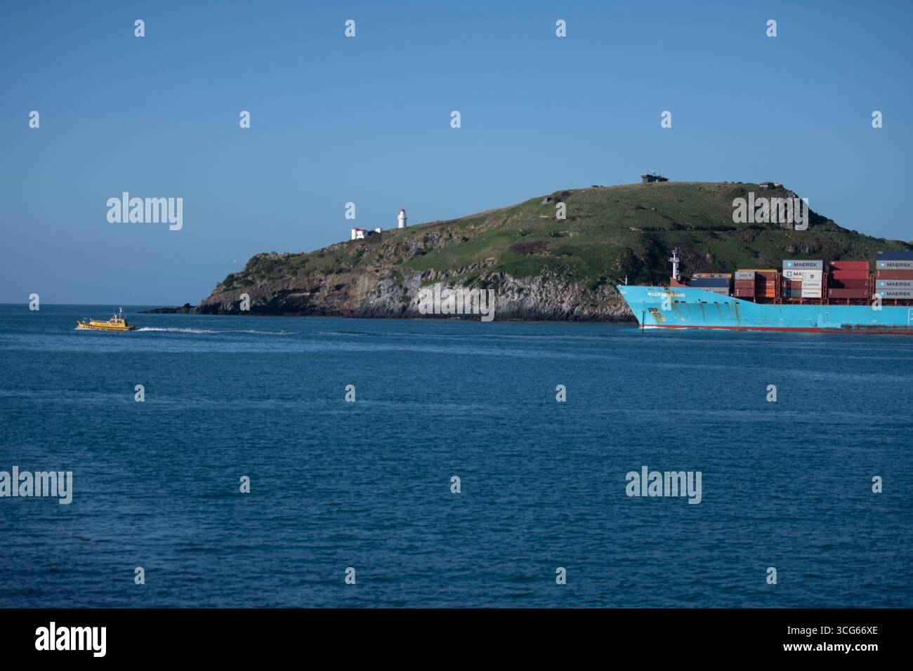 Tug pilot boat pulling Maersk Brani cargo ship through Dunedin harbour ...