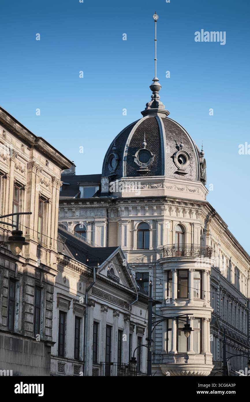 Historic building with ornate dome and balcony on Piotrkowska Street in ...