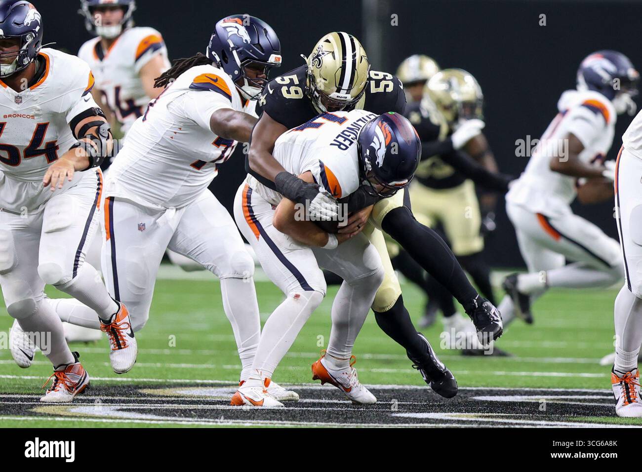 New Orleans Saints defensive end Jasheen Davis (59) sacks Denver ...