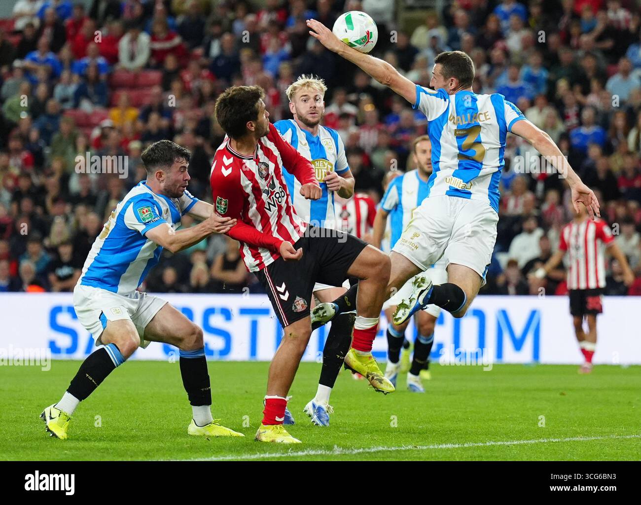 Huddersfield Town's Murray Wallace and Sunderland's Marc Guiu during ...