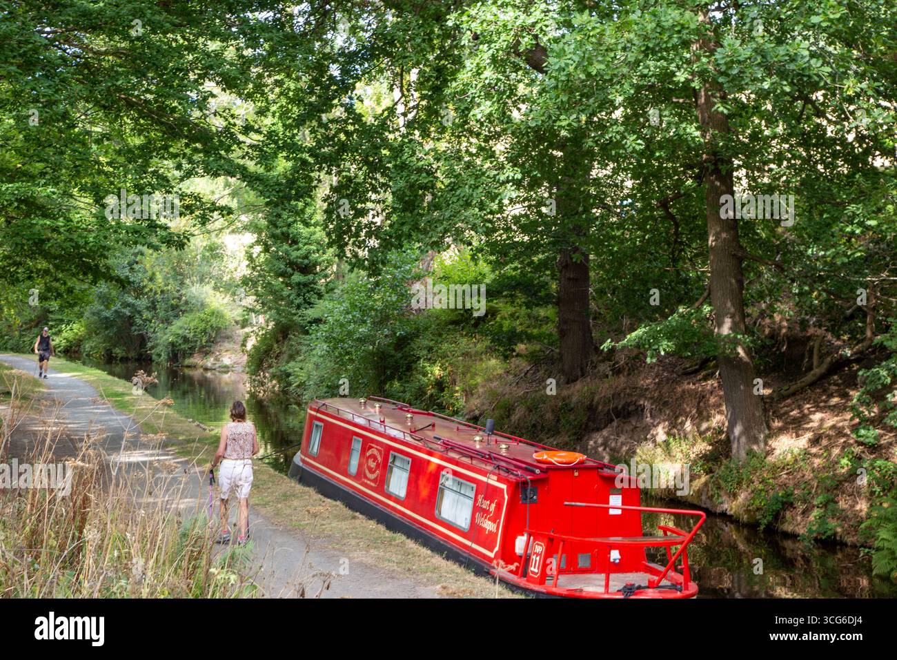 Colourful red narrowboat moored on the Llangollen branch of the ...