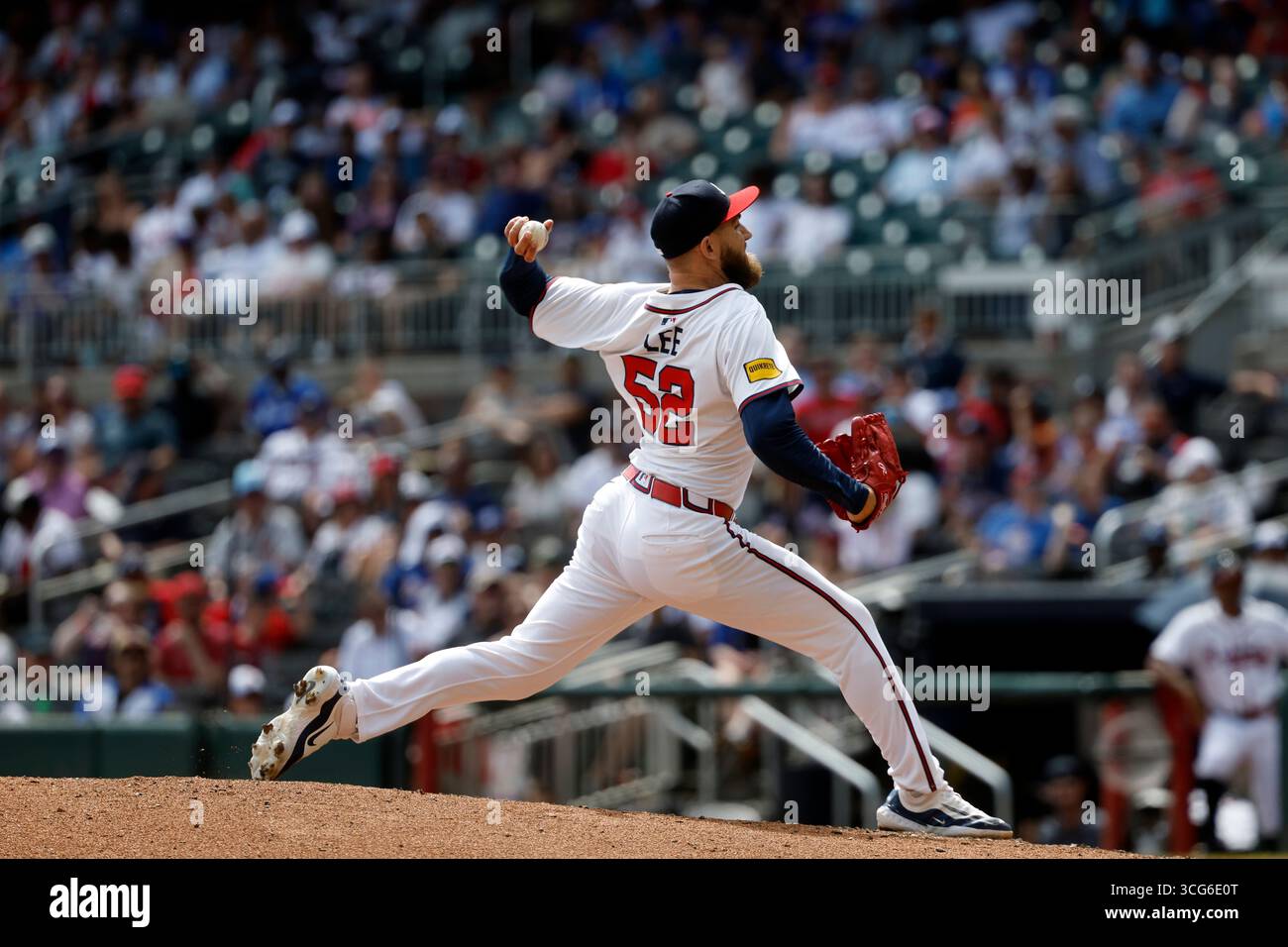 Atlanta Braves pitcher Dylan Lee throws during the seventh inning of a ...