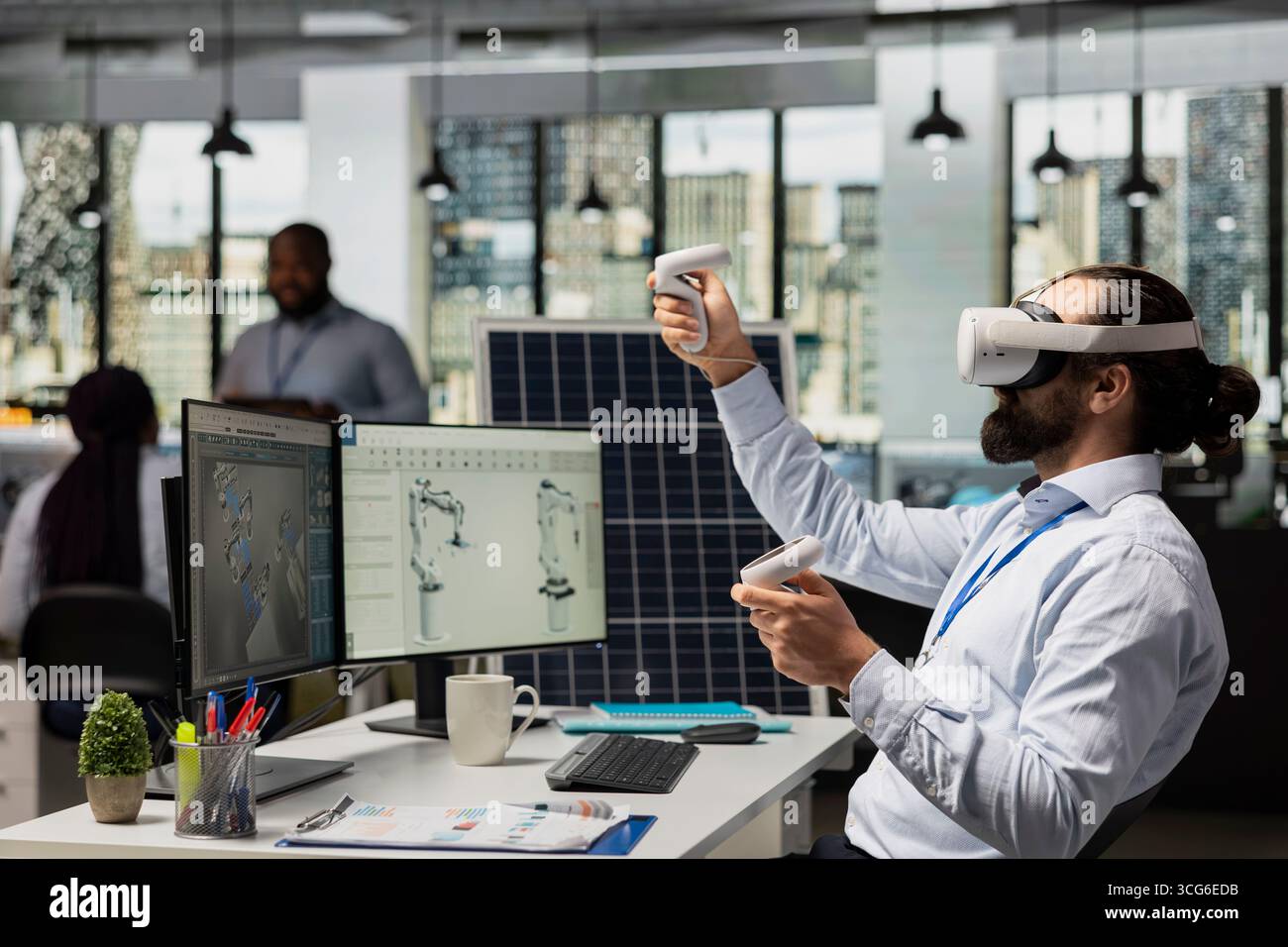 Engineer in office using VR headset to design solar panel cells with reduced carbon footprint ...