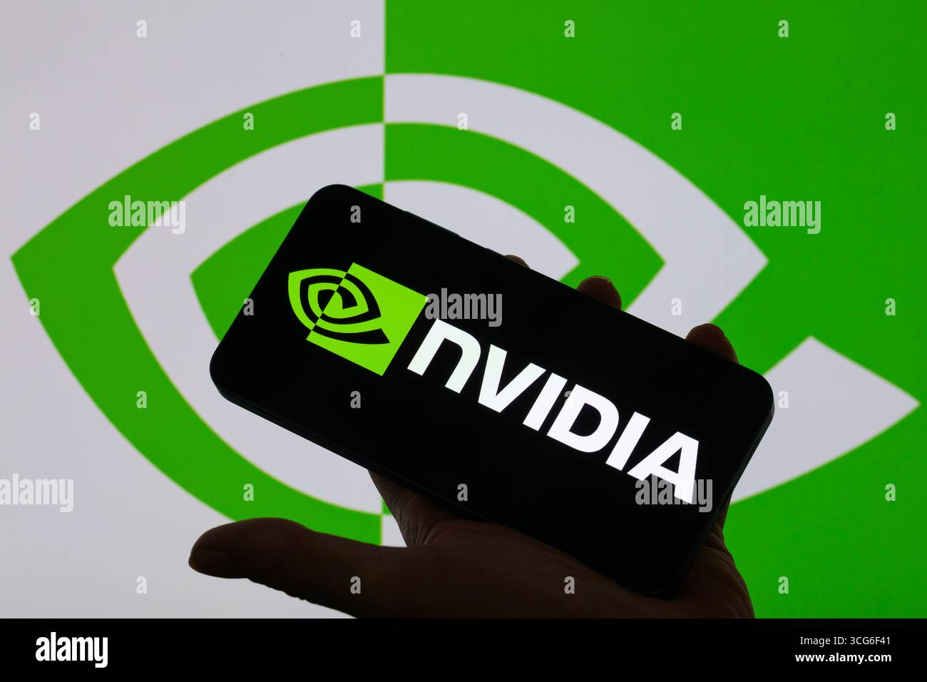 The NVIDIA logo is being displayed on a mobile phone with the company's ...