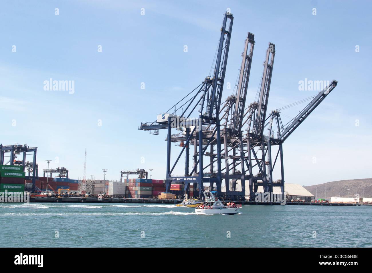 Ensenada, Baja California, Mexico - Mar 16, 2025: Harbor cranes are ...