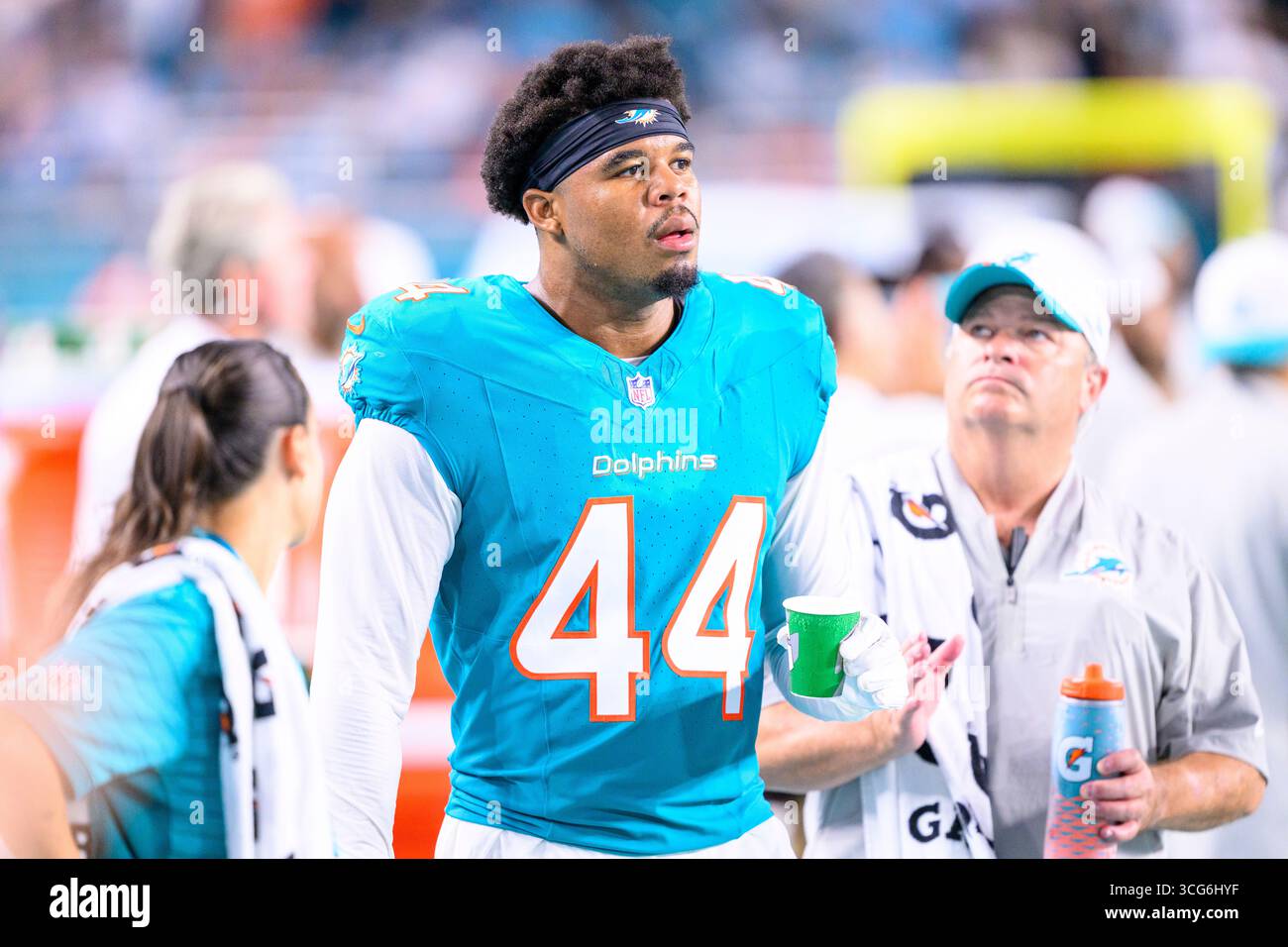 Miami Dolphins linebacker Chop Robinson (44) stands on the sidelines ...
