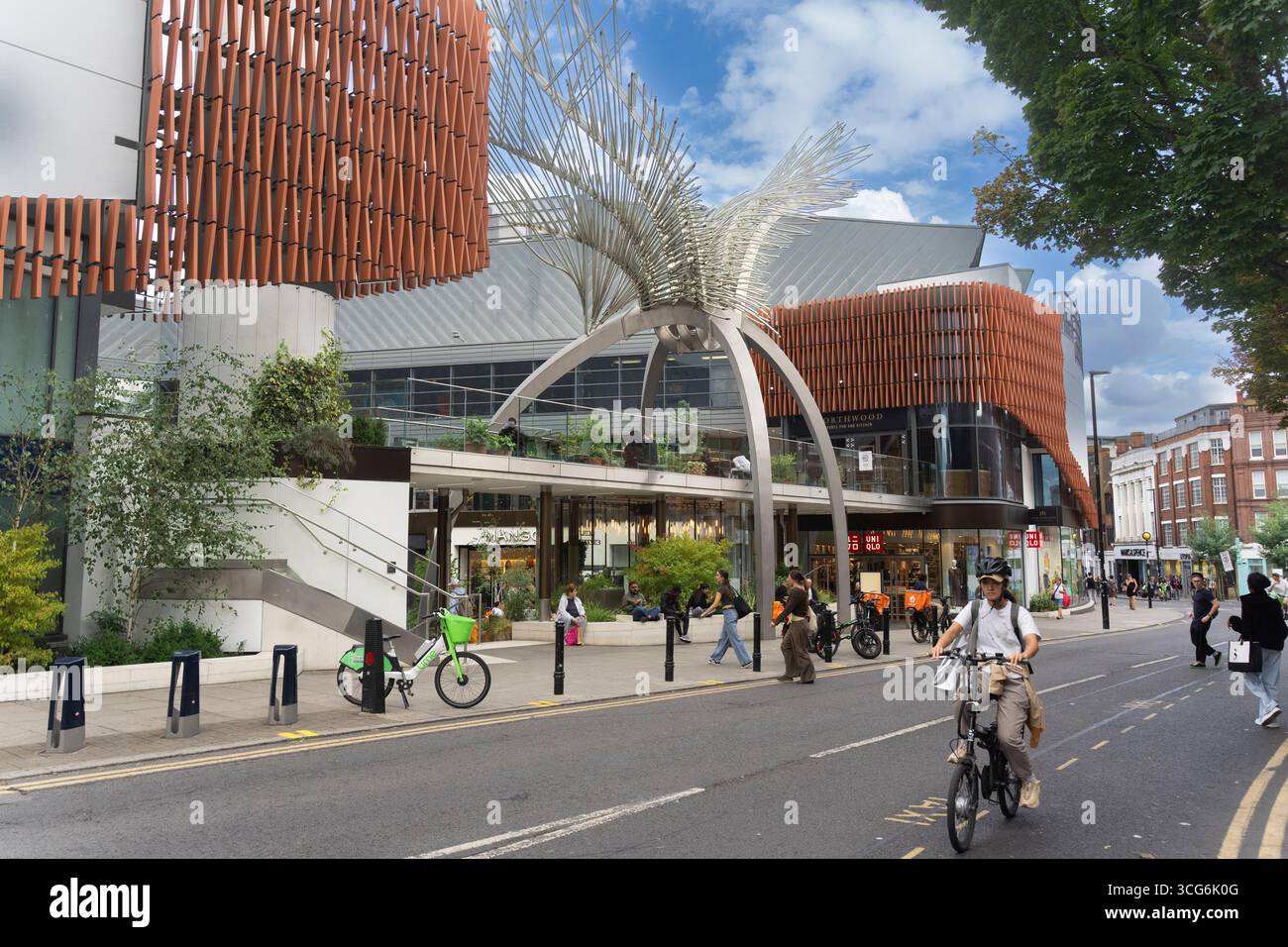 People are walking and cycling near Angel Central Islington Shopping ...