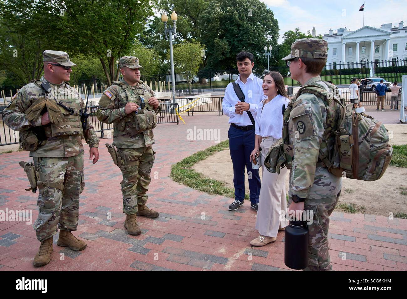 A woman asks members of the South Carolina National Guard if they are ...