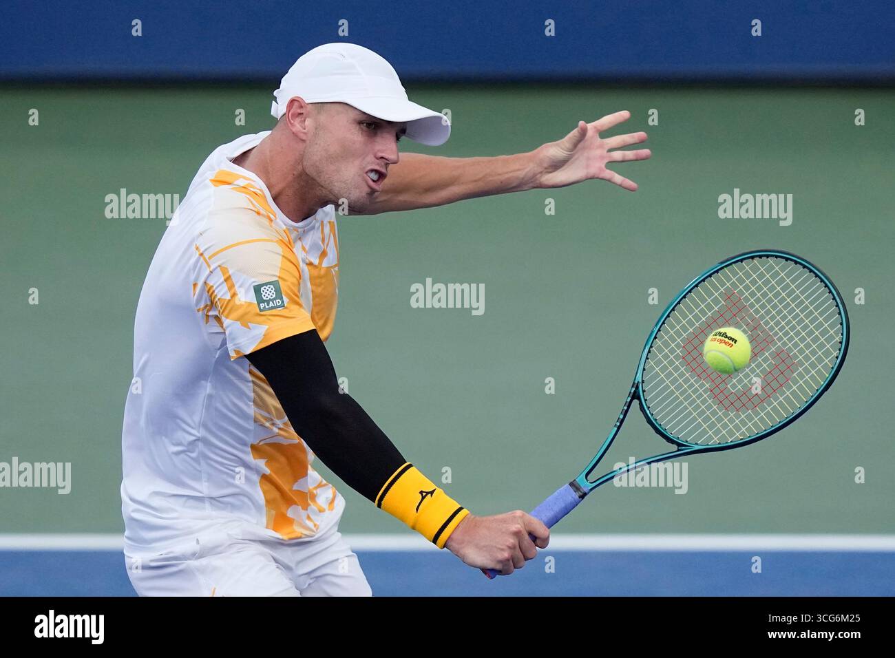 Christopher O'Connell, of Australia, returns a shot to Alex de Minaur ...
