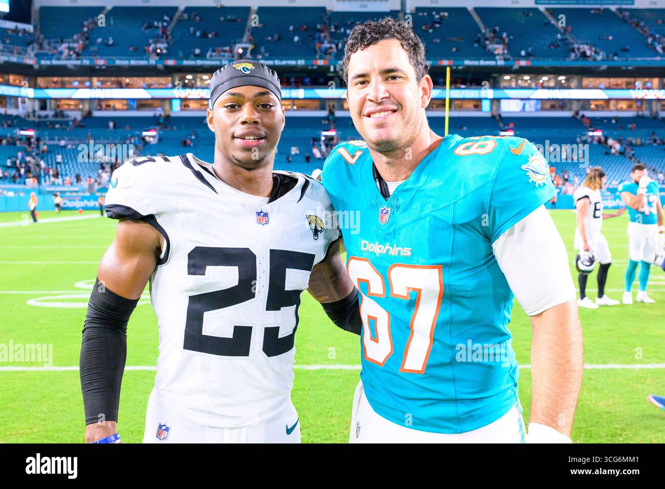 Miami Dolphins long snapper Joe Cardona (67) and Jacksonville Jaguars ...