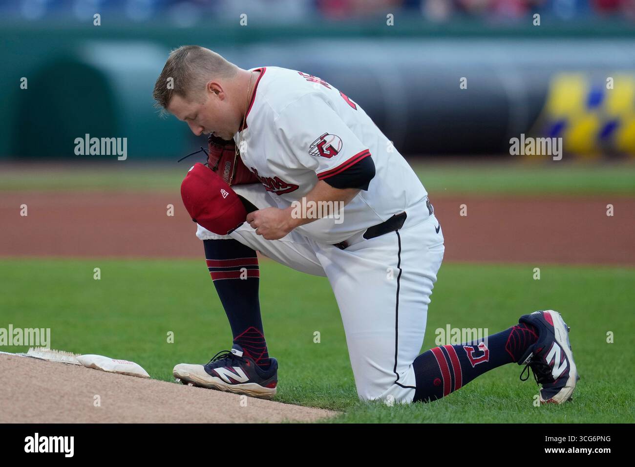 Cleveland Guardians starting pitcher Parker Messick kneels behind the ...