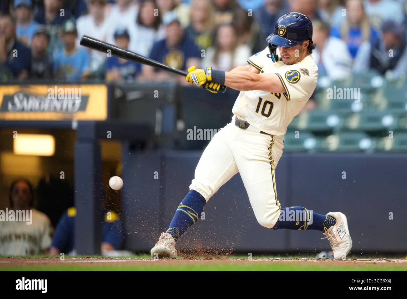 Milwaukee Brewers' Sal Frelick (10) hits an infield single during the ...