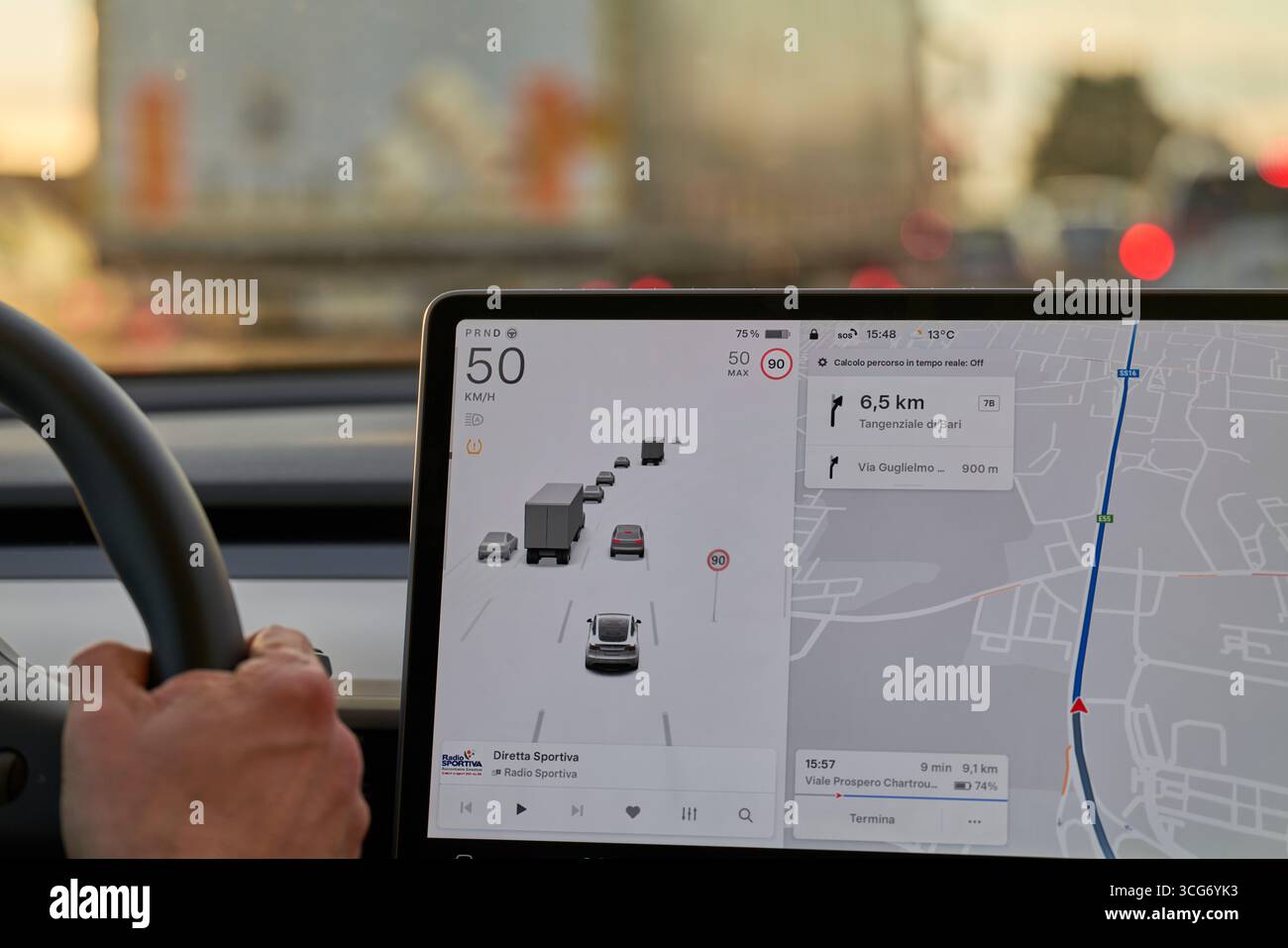 Tesla Model Y digital display while driving Stock Photo - Alamy