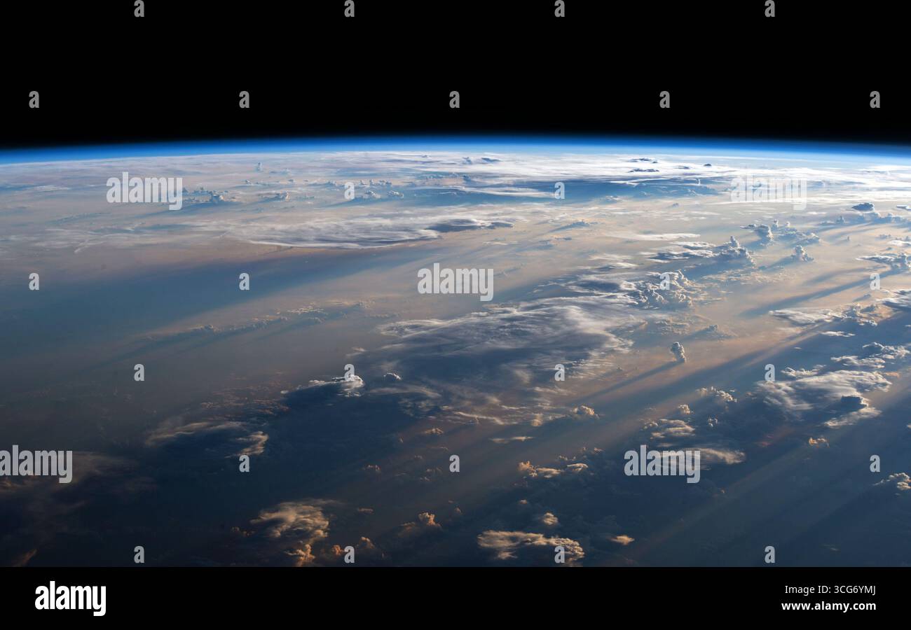 An image of the cloud-filled stratosphere from space A sunrise casts ...