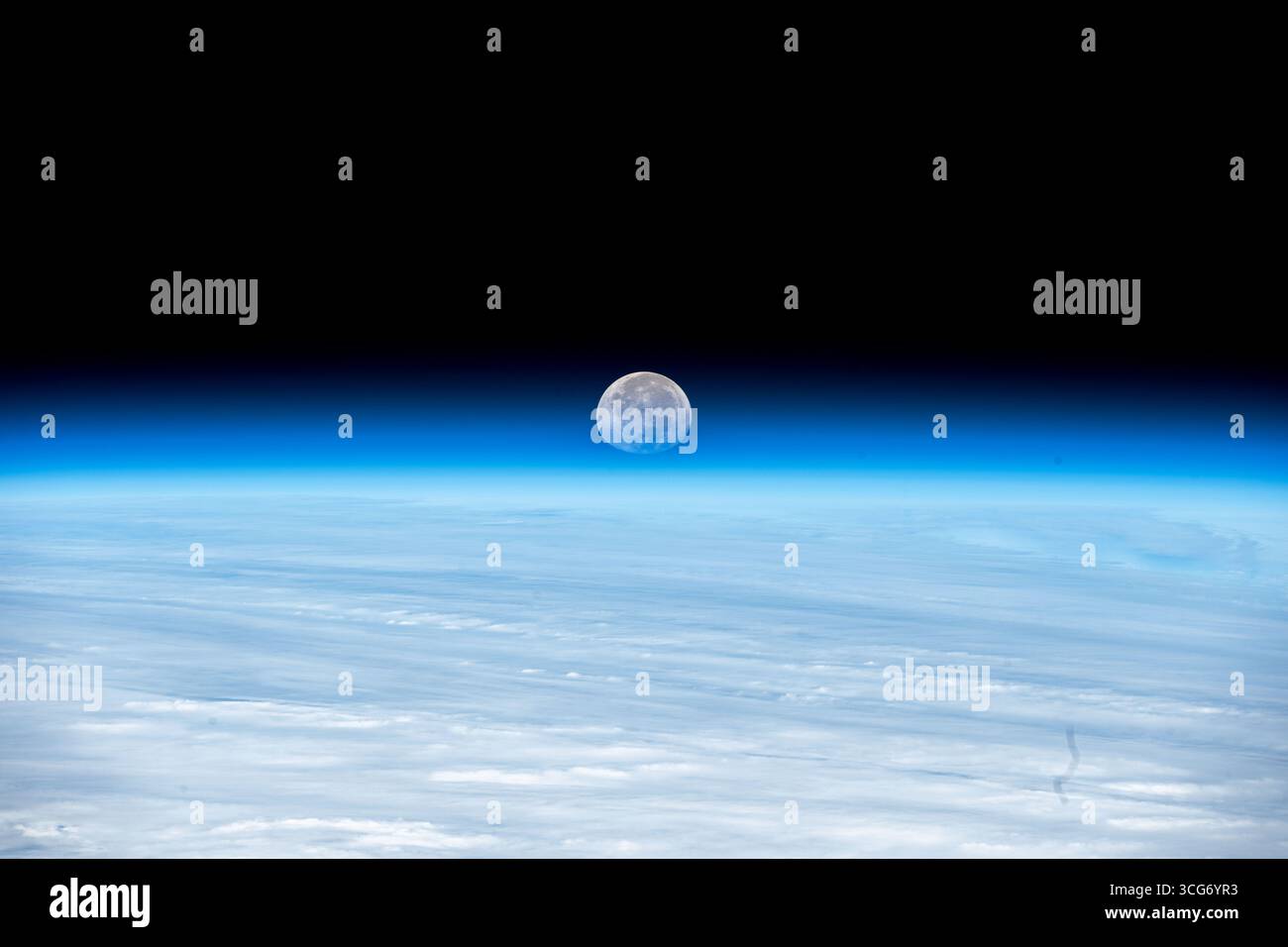 Full moon rising / setting beyond Earth's horizon. photographed from ...