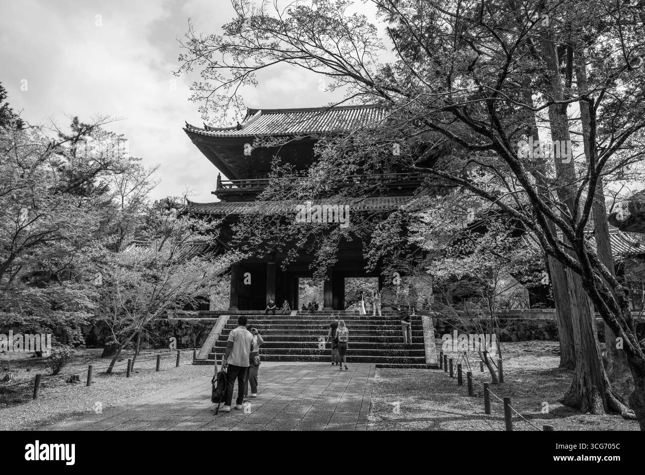 A serene, monochrome scene of Sanmon Gate on the grounds of Nanzen-ji ...