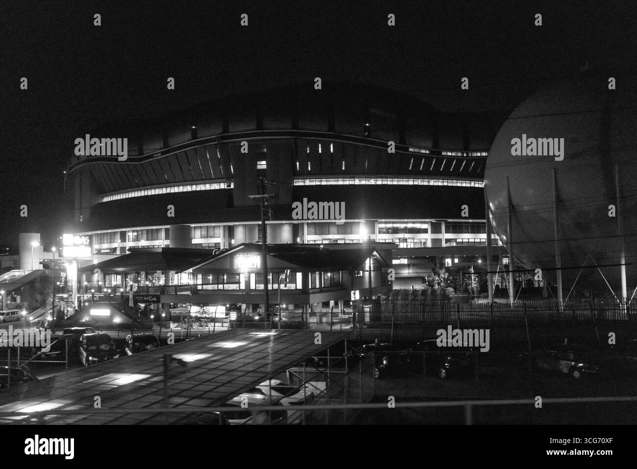 Nighttime view of Kyocera Dome Osaka building illuminated by lights ...