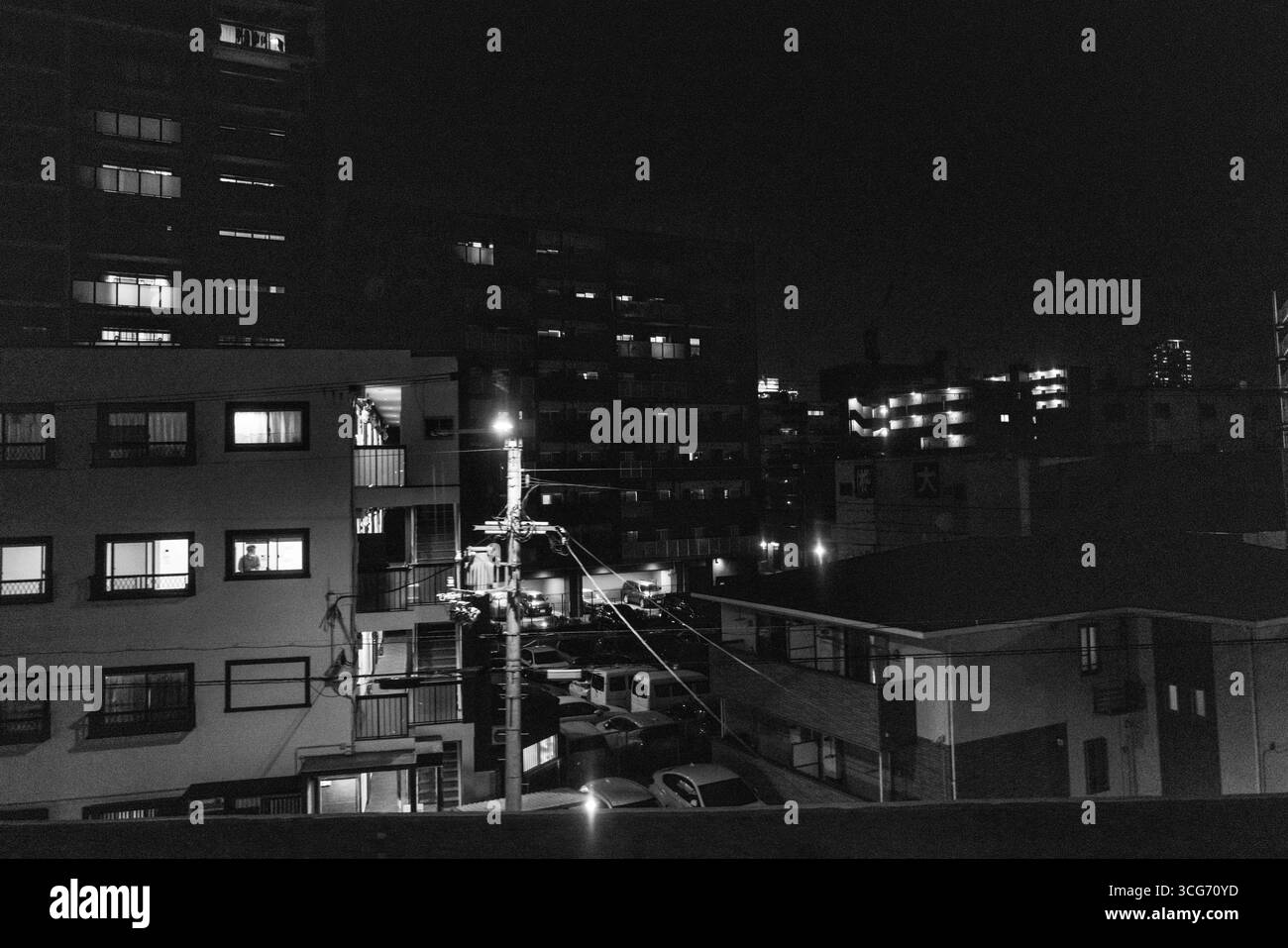 A nighttime Osaka cityscape showcasing residential and commercial ...