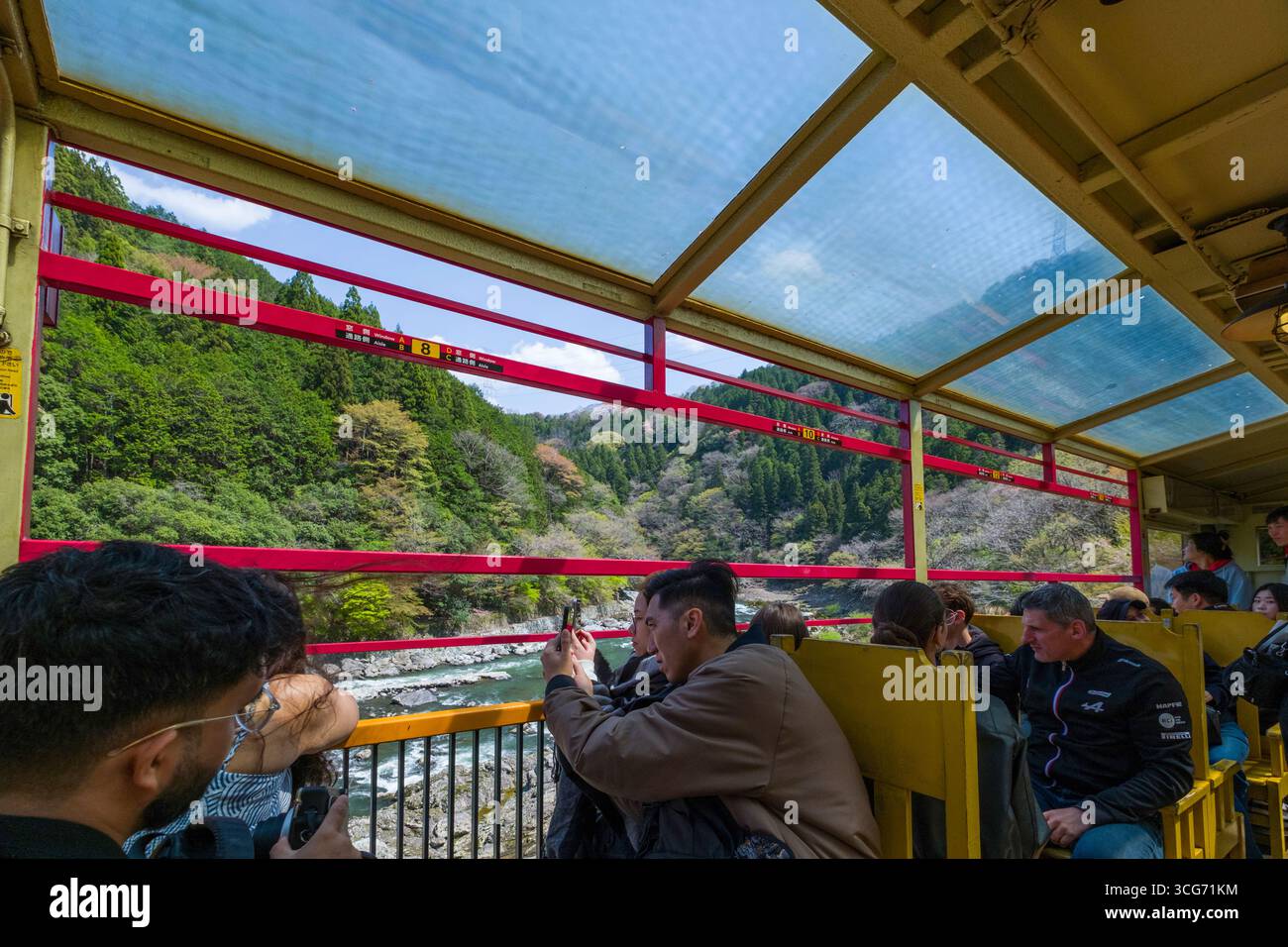Tourist enjoying the scenic views of the Katsura River valley from the ...
