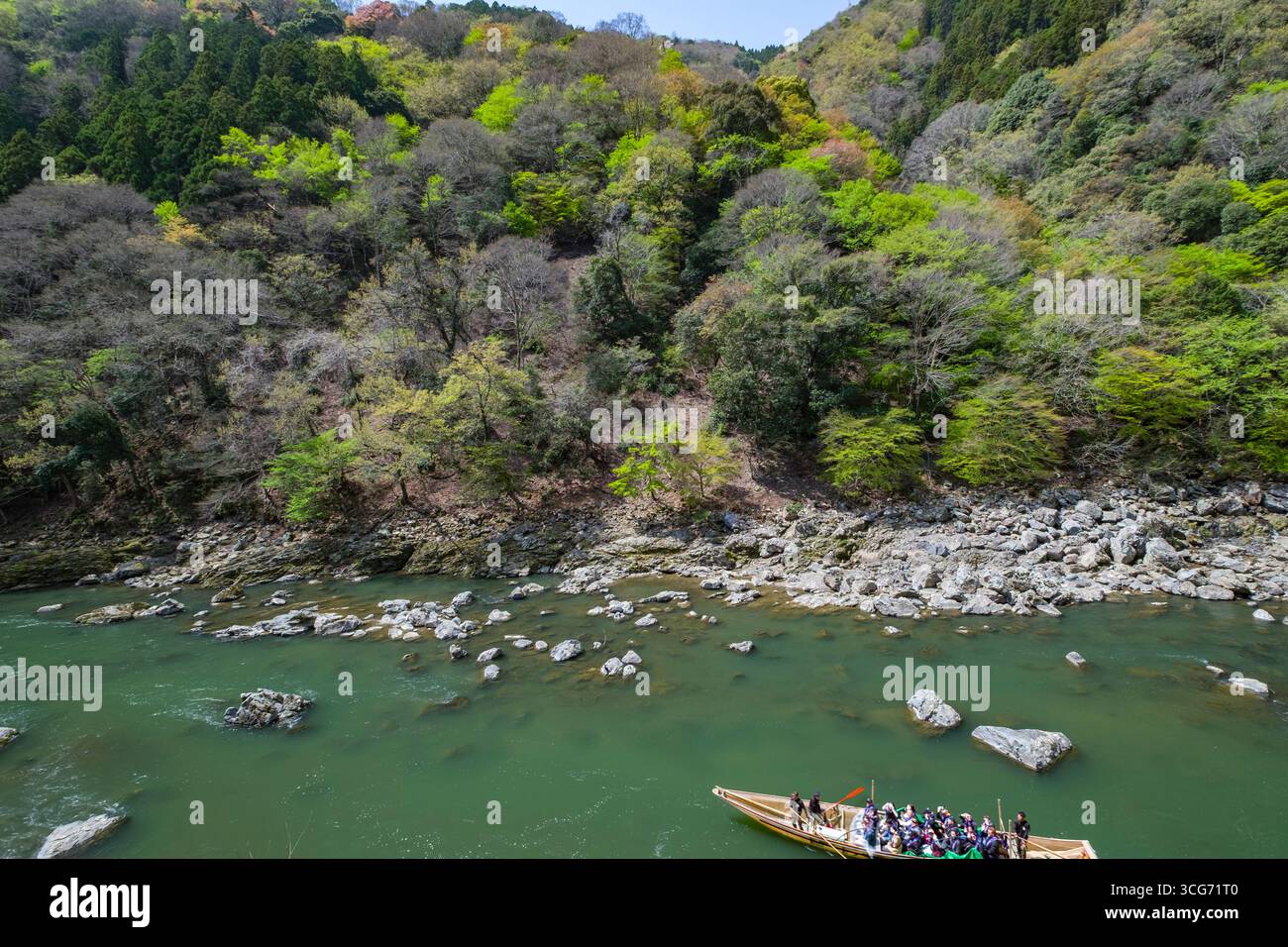 Tourist on boat ride in the Katsura River valley seen from Sagano ...