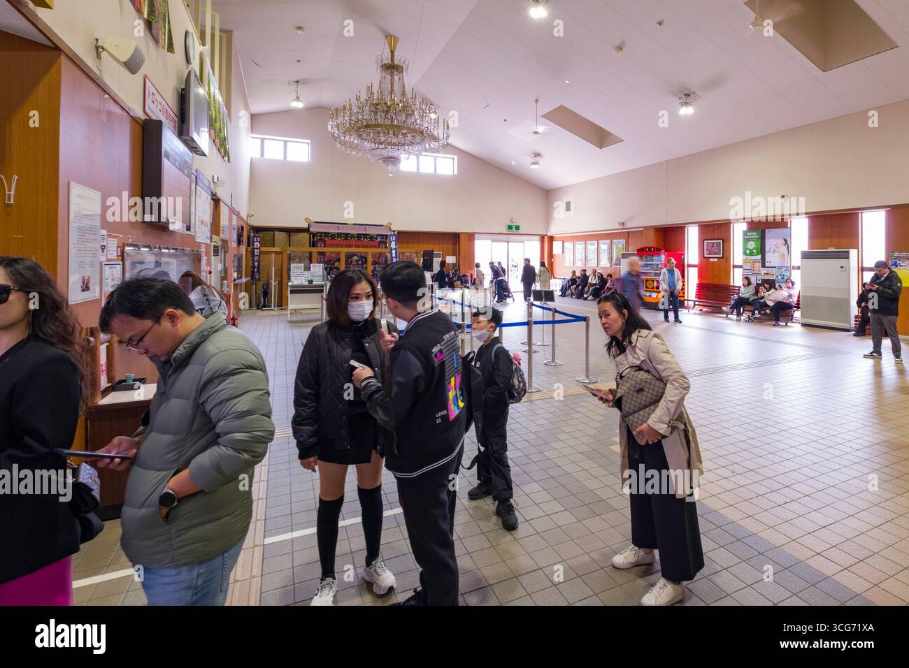 People standing inside Saga Torokko Station, Sagatenryuji ...