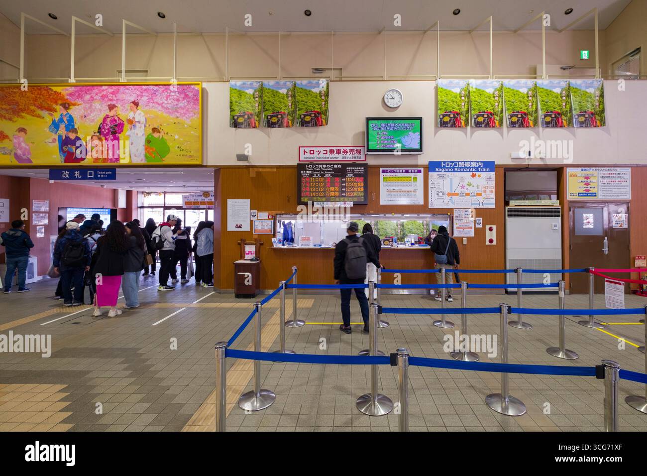 People standing inside Saga Torokko Station, Sagatenryuji ...