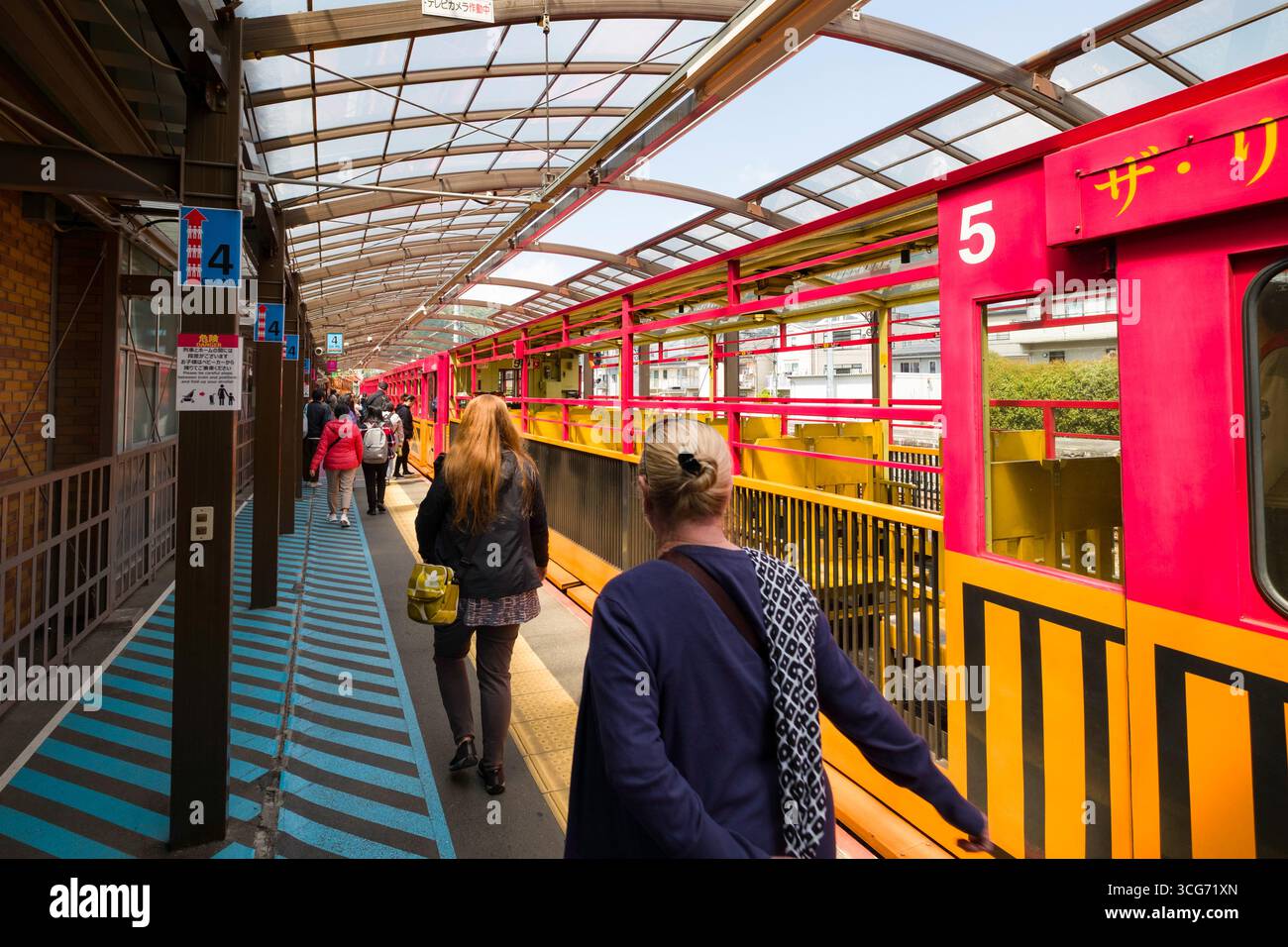 Tourist walking on train platform to board the Sagano romantic train at ...