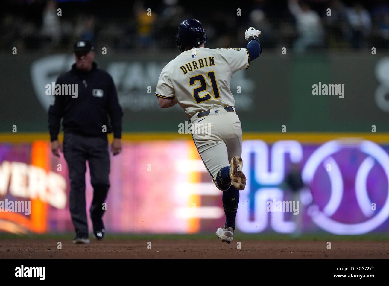 Milwaukee Brewers' Caleb Durbin rounds the bases after hitting a home ...
