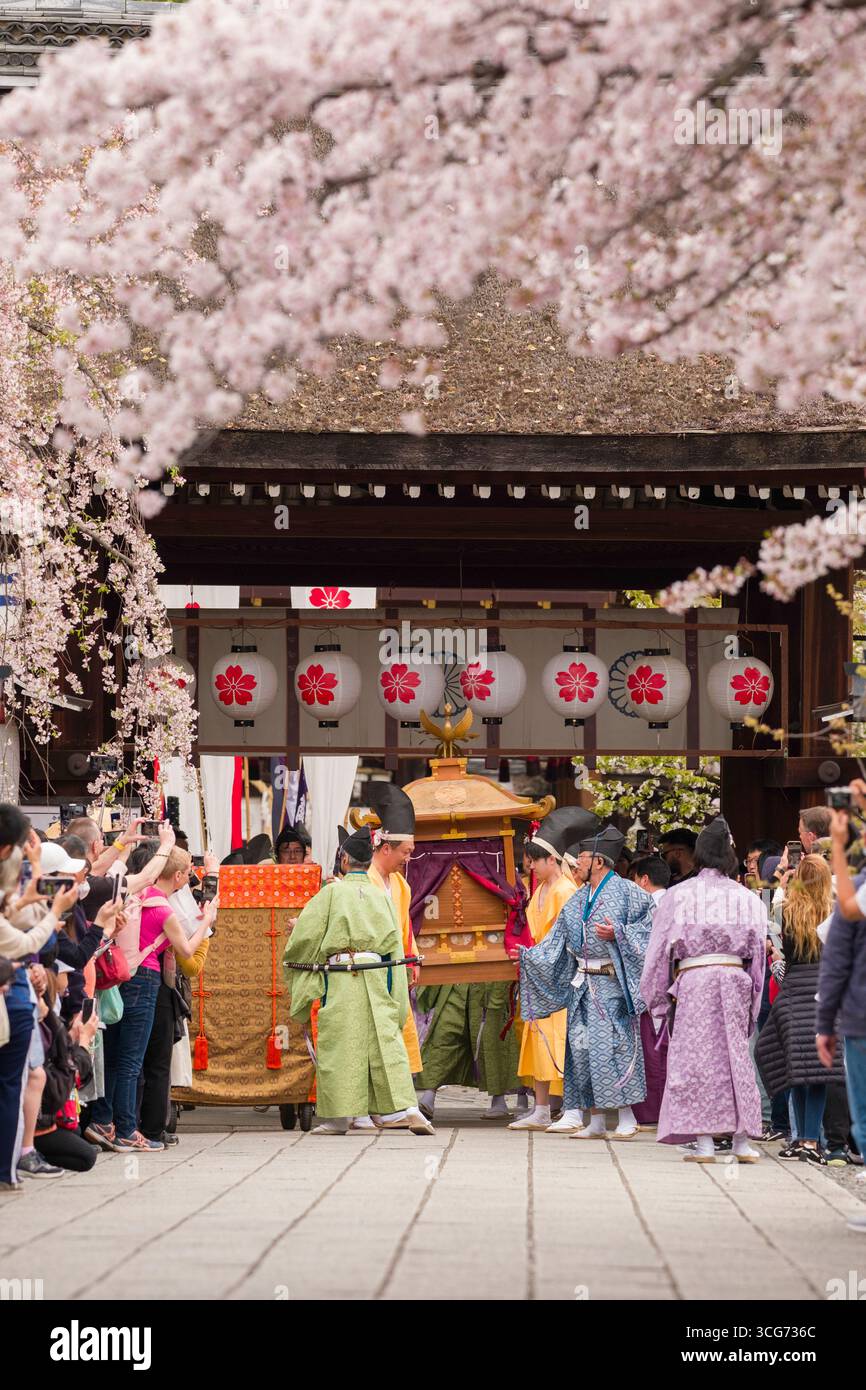 Men dressed in traditional Shinto attire lifting the Mikoshi sacred ...