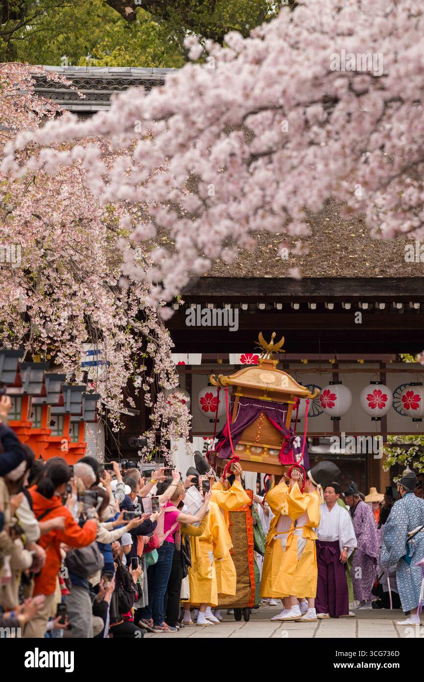 Men dressed in traditional Shinto attire lifting the Mikoshi sacred ...