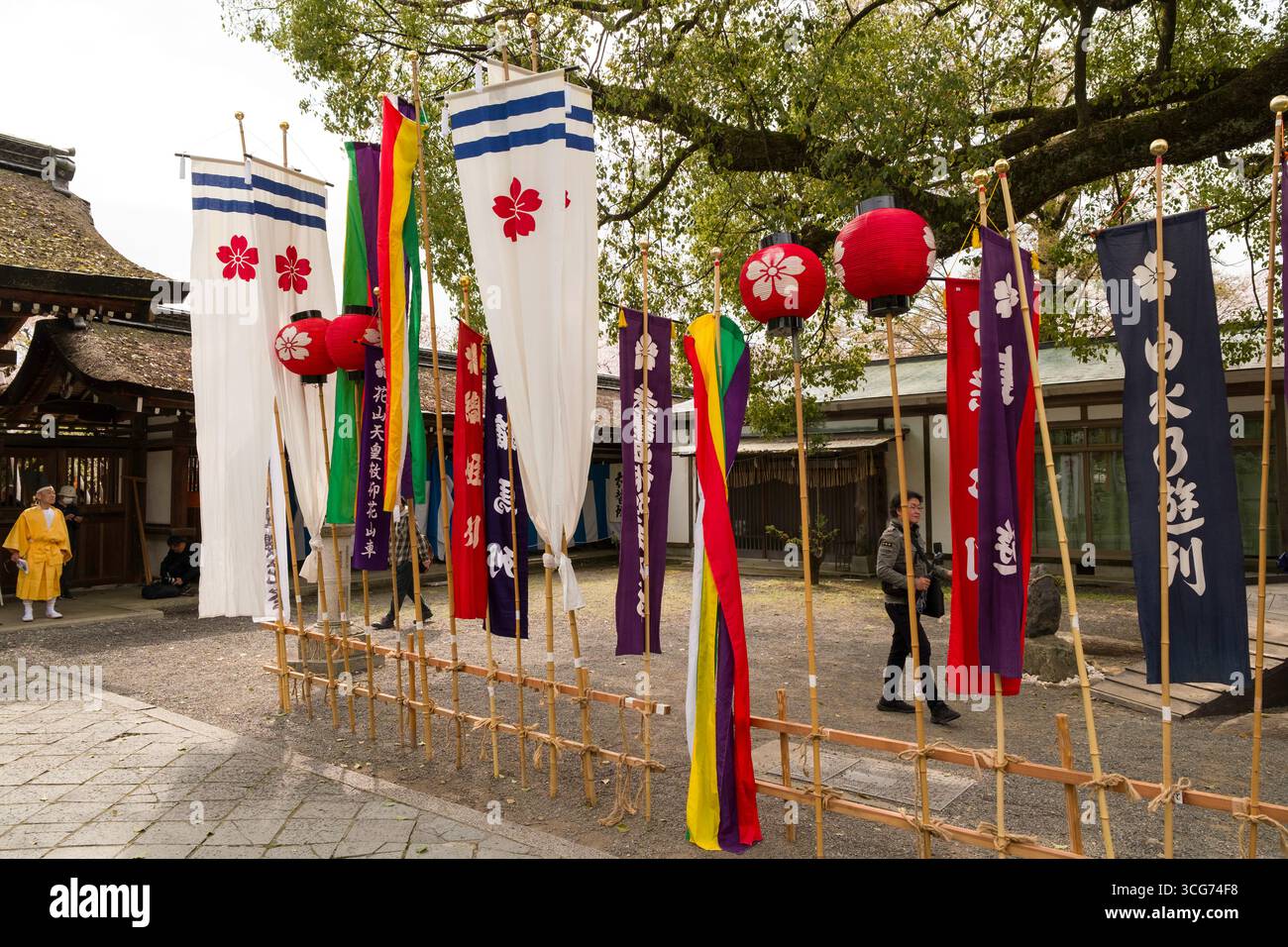 A row of colorful banners and flags on display during the Oukasai ...